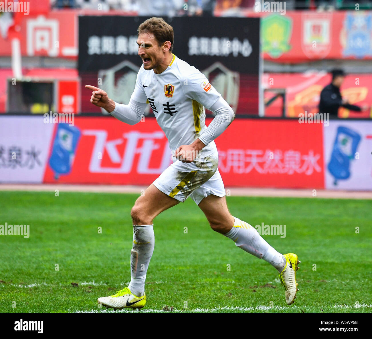 Croatian football player Nikica Jelavic, right, of Guizhou Hengfeng ...