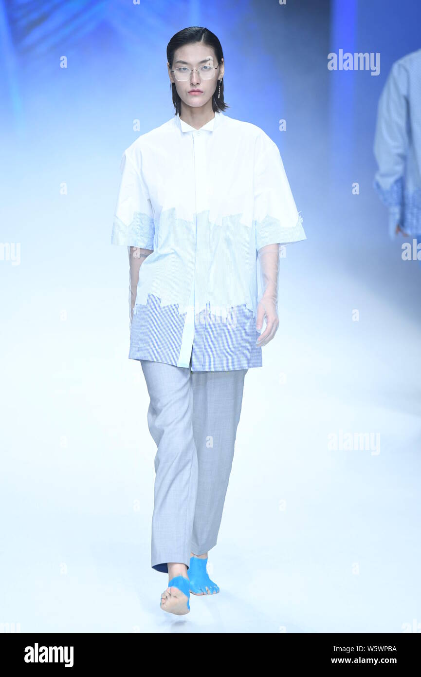 A model displays a new creation at the fashion show of Oriental Modern ...