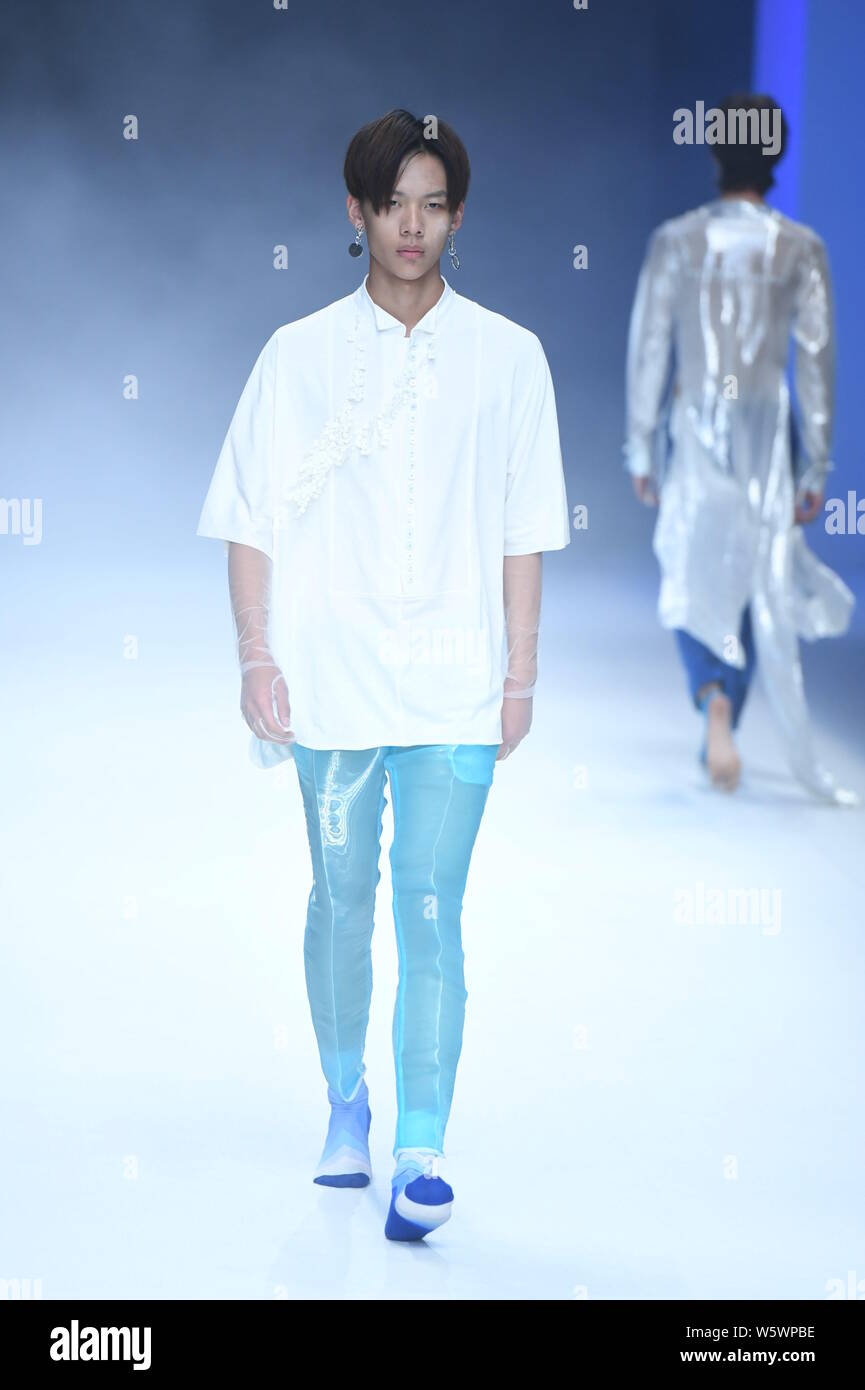A model displays a new creation at the fashion show of Oriental Modern ...