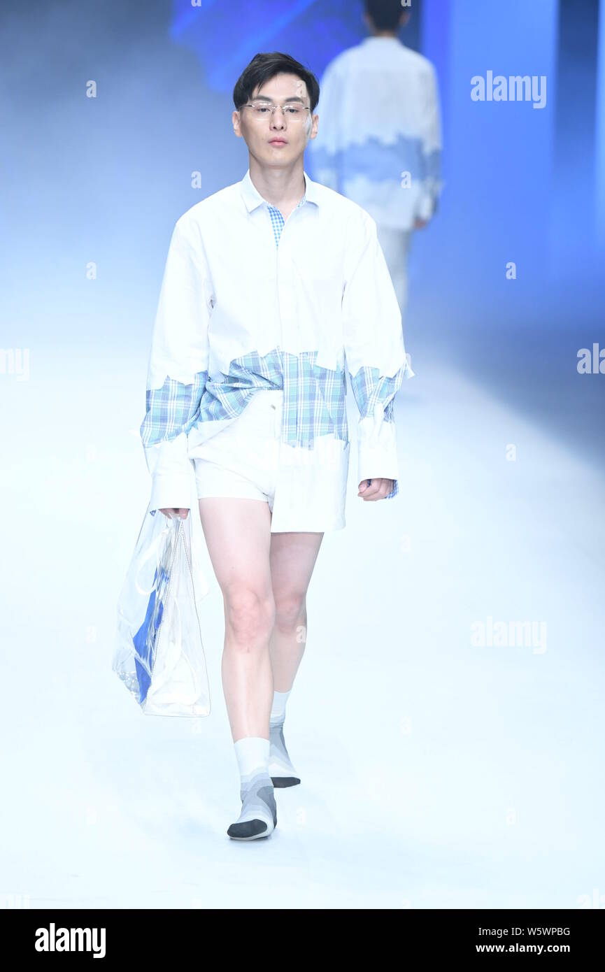 A model displays a new creation at the fashion show of Oriental Modern ...