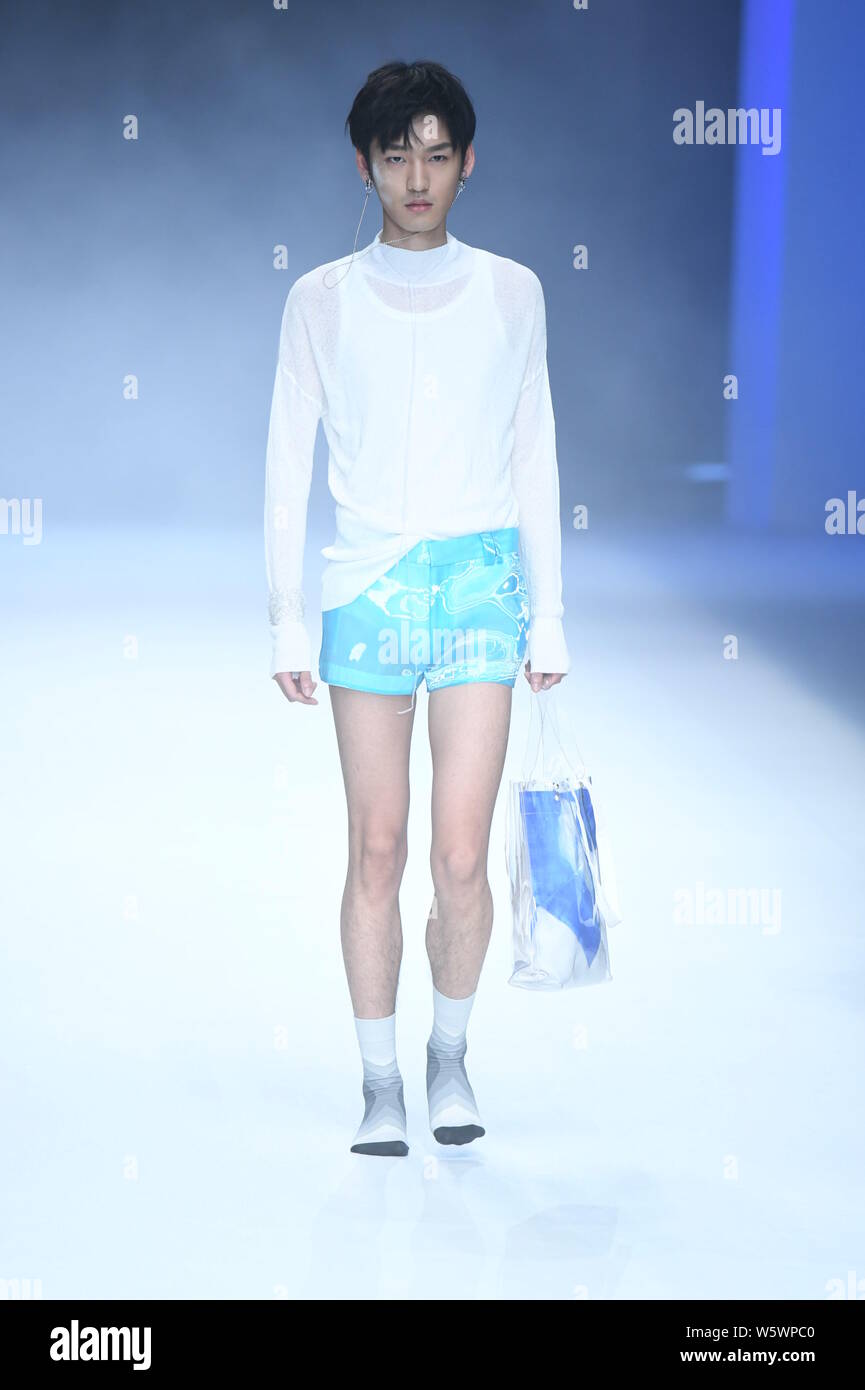 A model displays a new creation at the fashion show of Oriental Modern ...