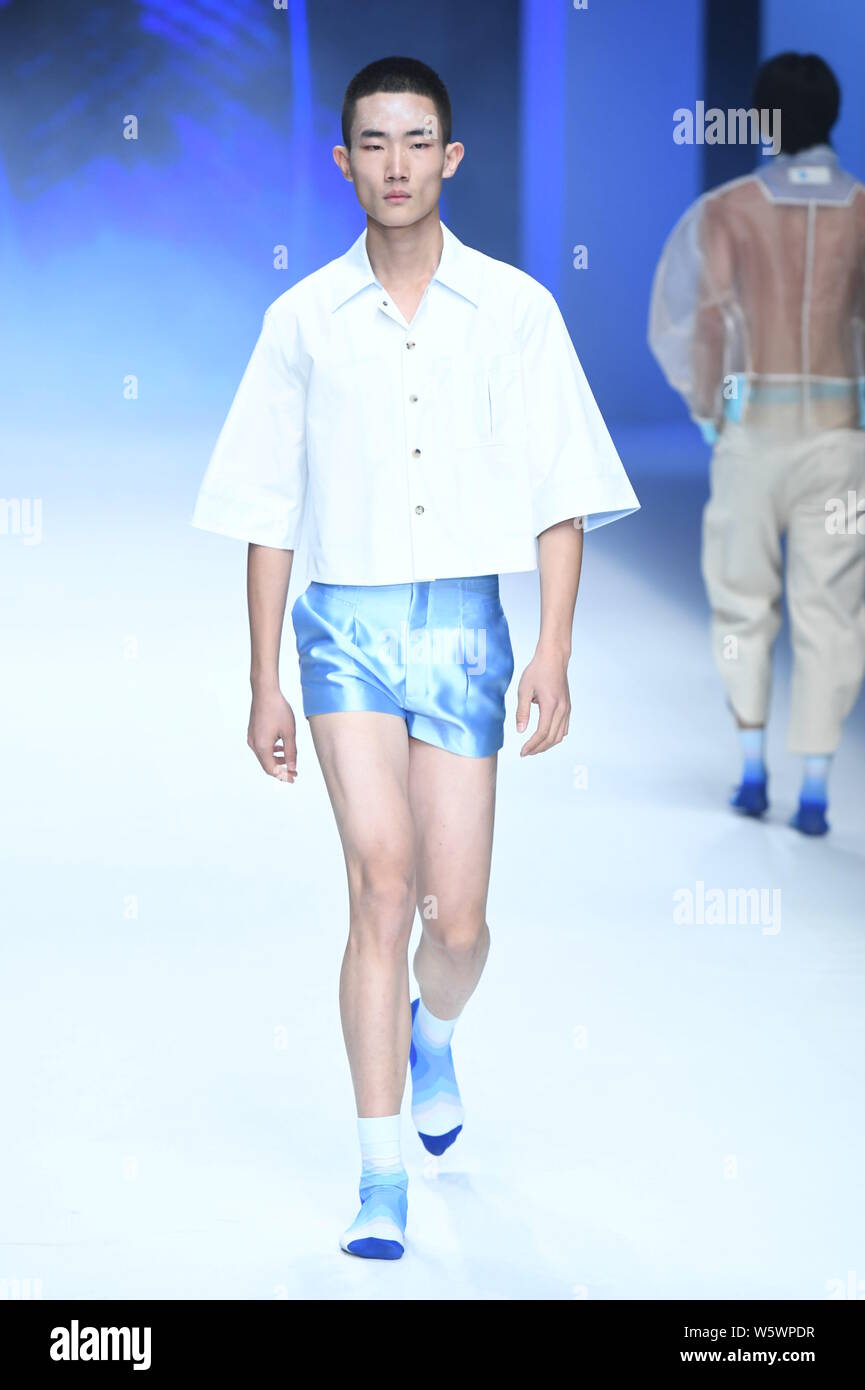 A model displays a new creation at the fashion show of Oriental Modern ...