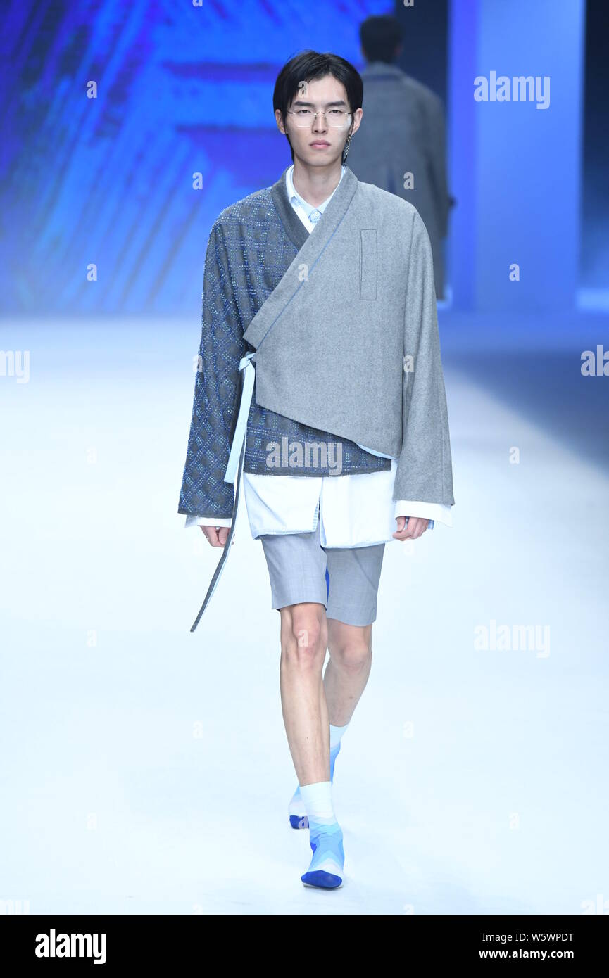 A model displays a new creation at the fashion show of Oriental Modern ...