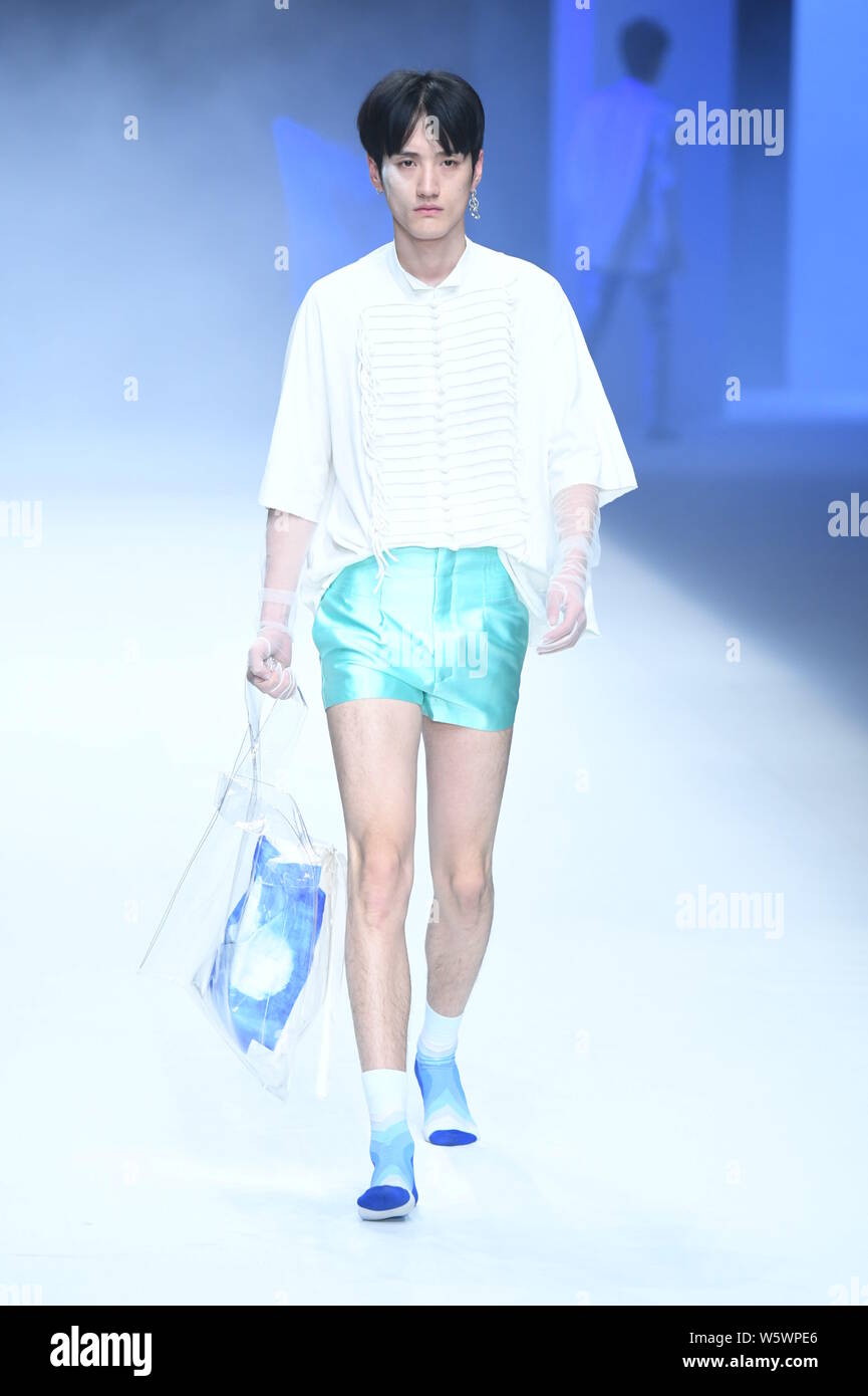A model displays a new creation at the fashion show of Oriental Modern ...