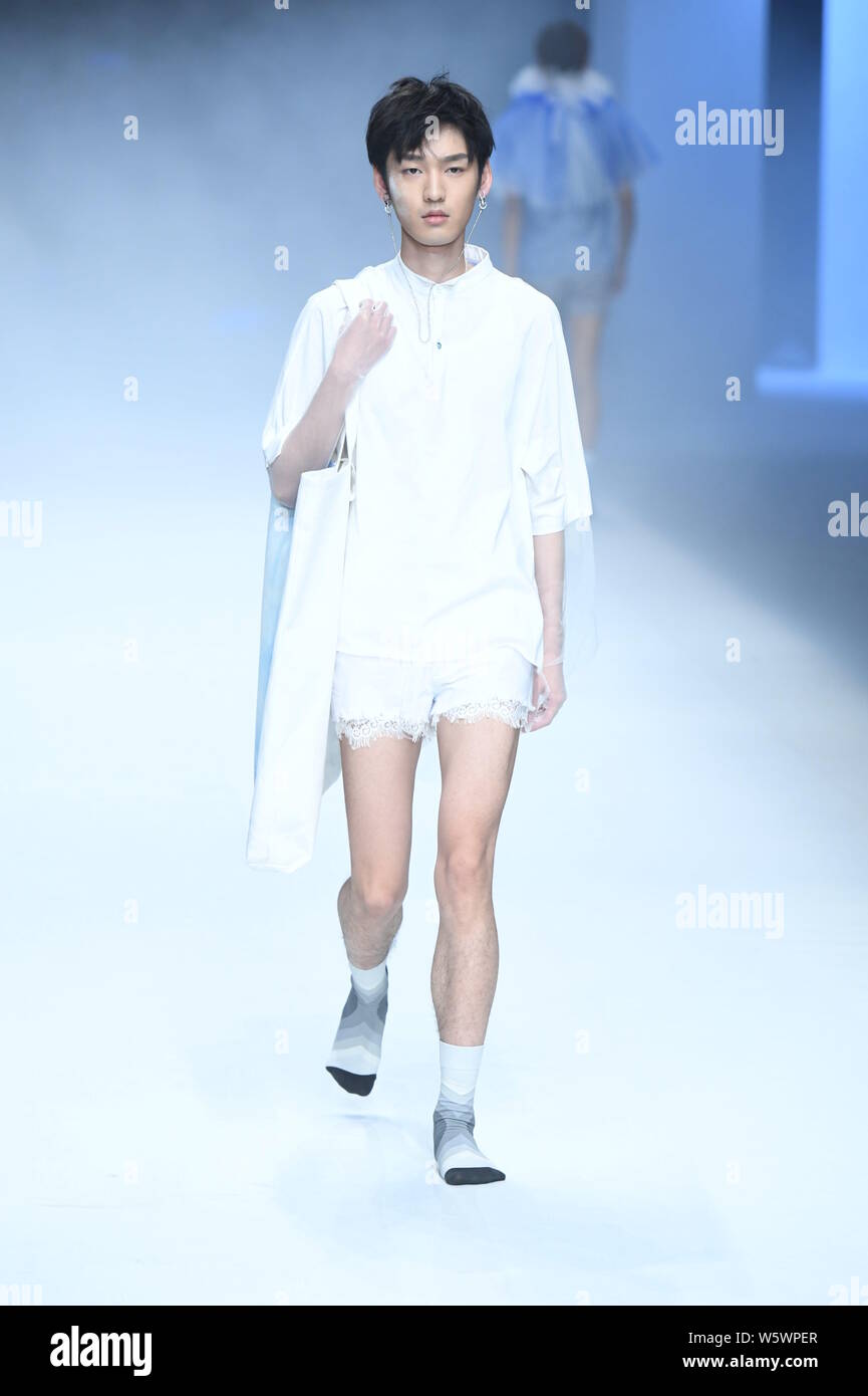 A model displays a new creation at the fashion show of Oriental Modern ...