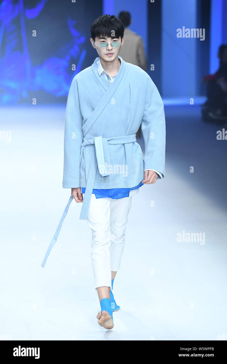 A model displays a new creation at the fashion show of Oriental Modern ...