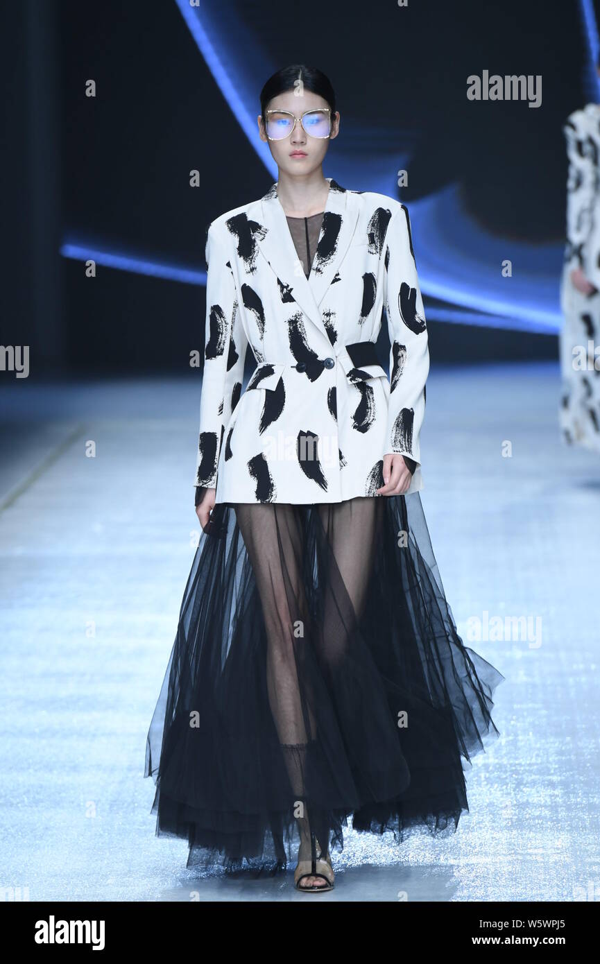 A model displays a new creation at the fashion show of Oriental Modern Center Á Jean&Nylah by ...