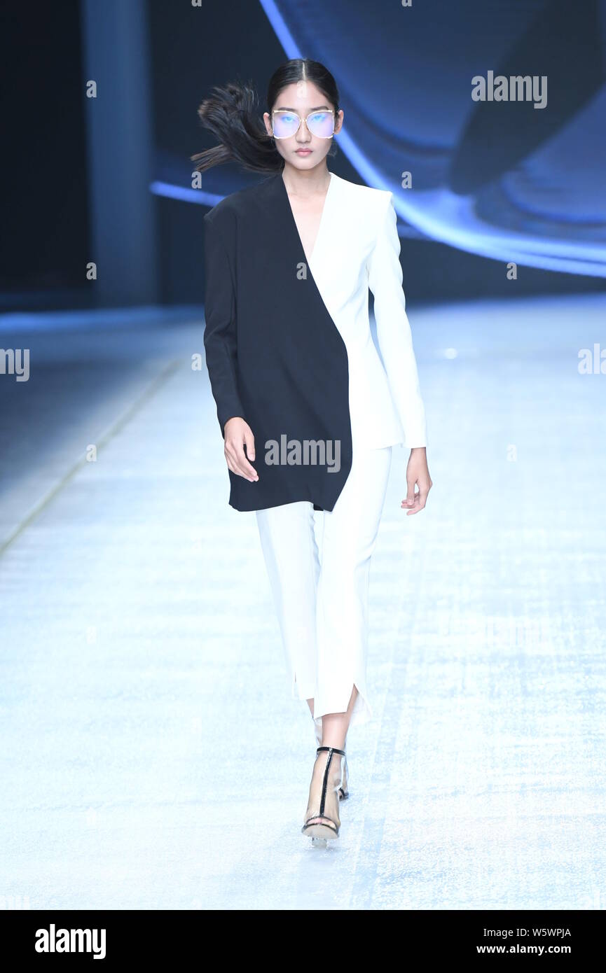 A model displays a new creation at the fashion show of Oriental Modern Center Á Jean&Nylah by ...