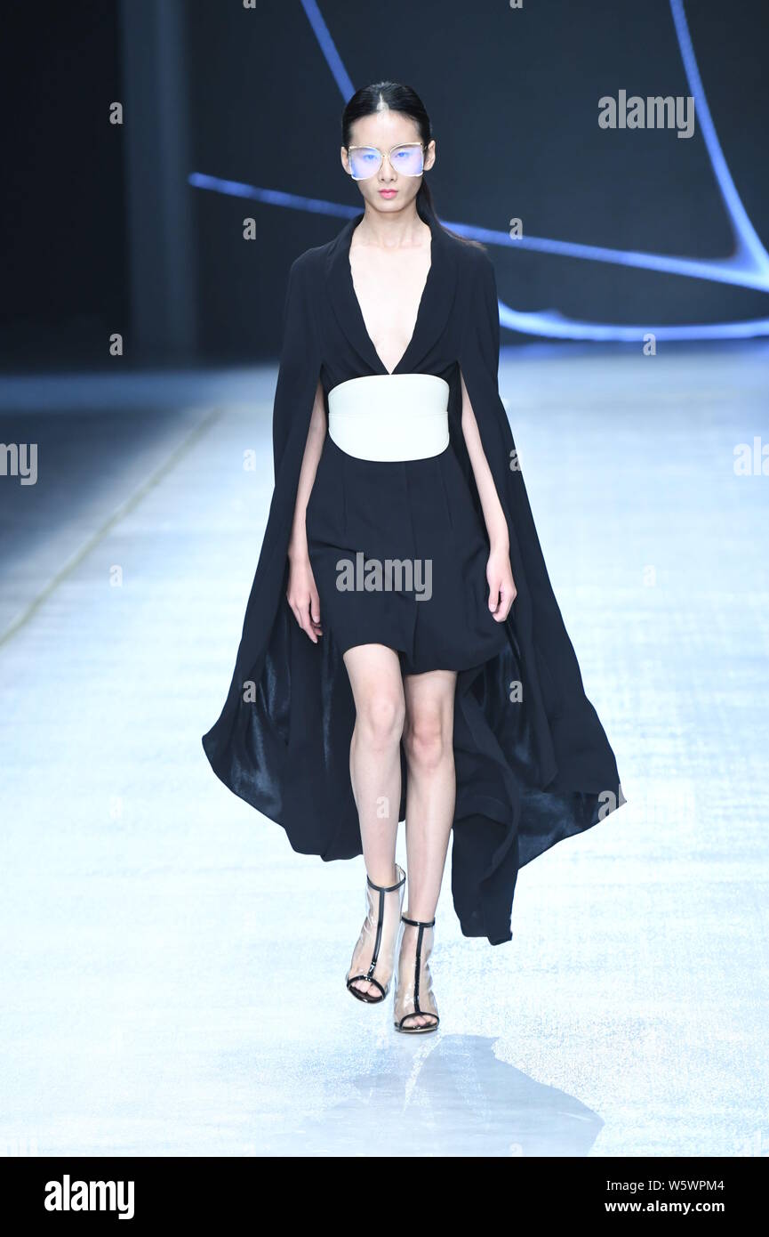 A model displays a new creation at the fashion show of Oriental Modern Center Á Jean&Nylah by ...