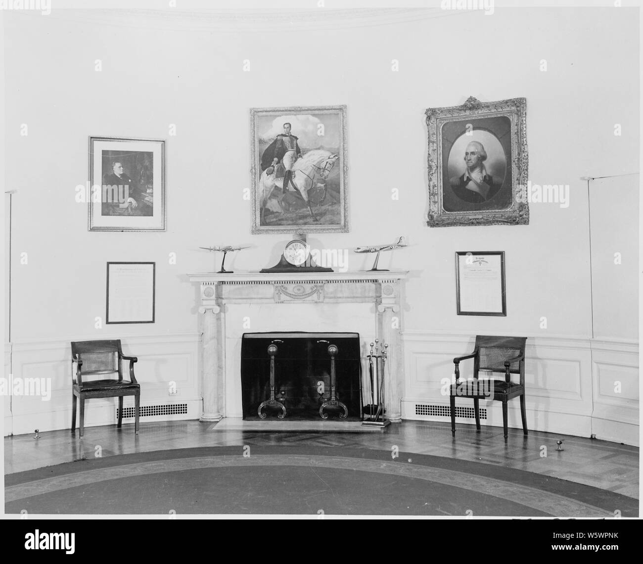 Photograph of the fireplace in the Oval Office of the White House, with ...