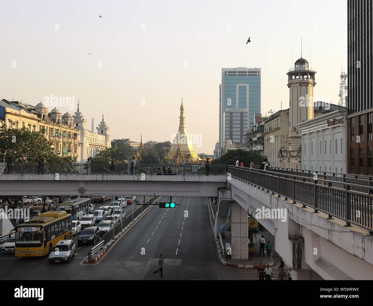 Old and modern buildings on streets of Yangon, the former burmese ...