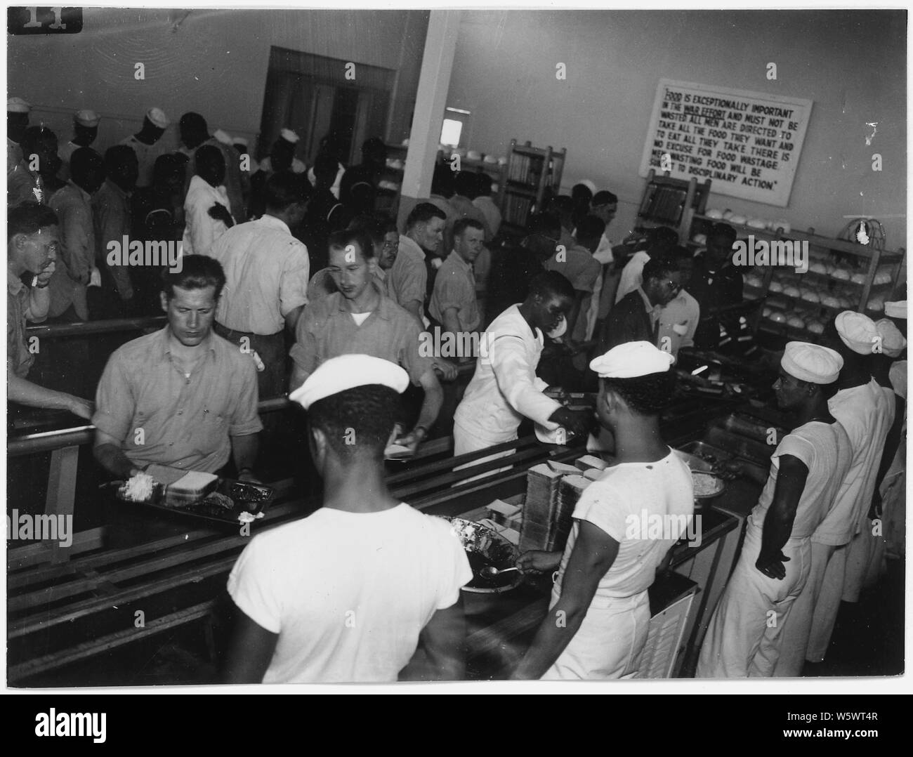 Photograph with caption Cafeteria Lines in Mess Hall at Naval Barracks ...