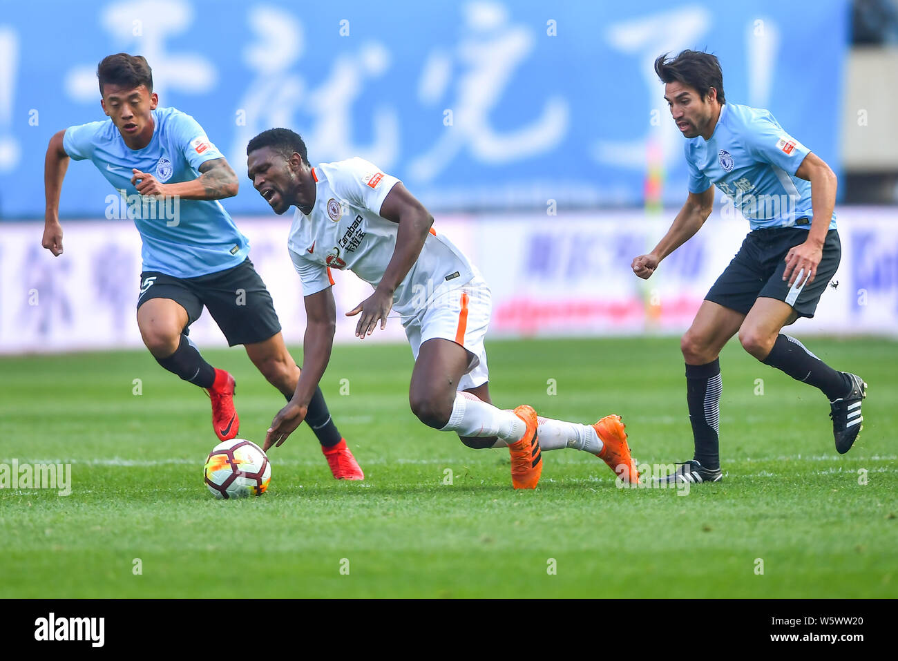 Senegalese football player Makhete Diop, center, of Beijing Renhe ...