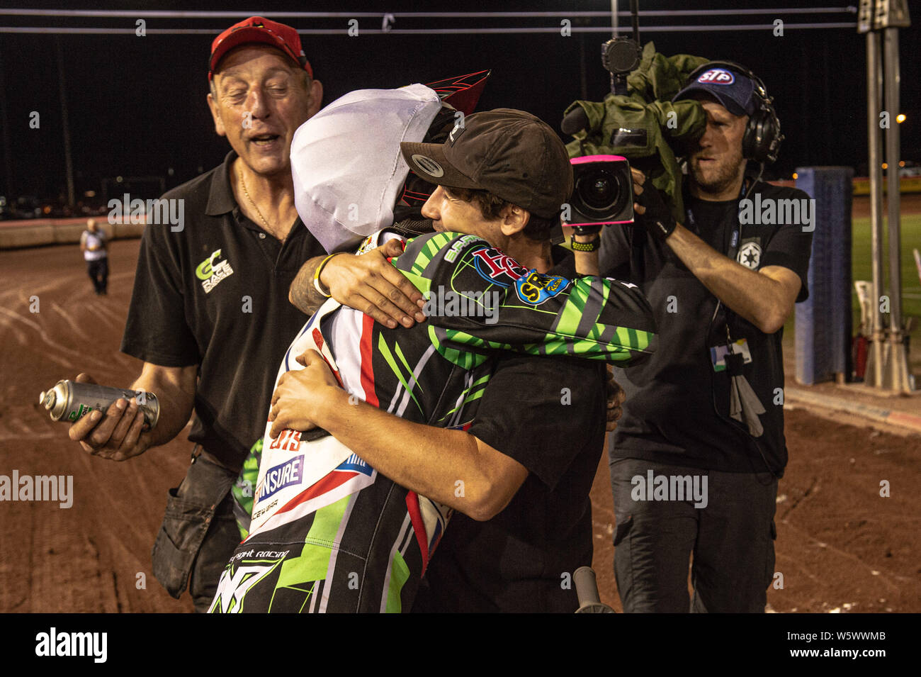 Manchester, England. 29th July 2019 Charles Wright is congratulated on ...