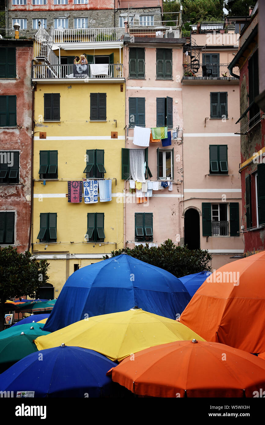 Colorful umbrellas and detailed and colorful facades in the coastal ...