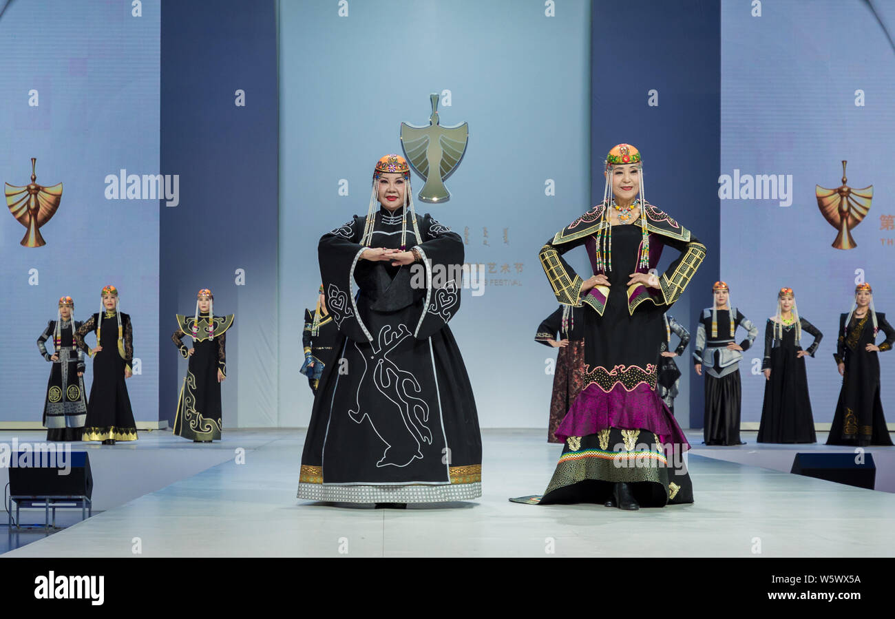 Models display new creations of traditional Mongolian costumes during ...