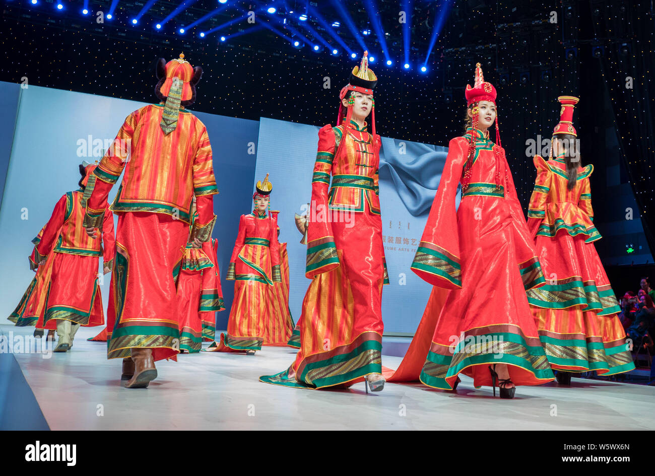 Models display new creations of traditional Mongolian costumes during ...