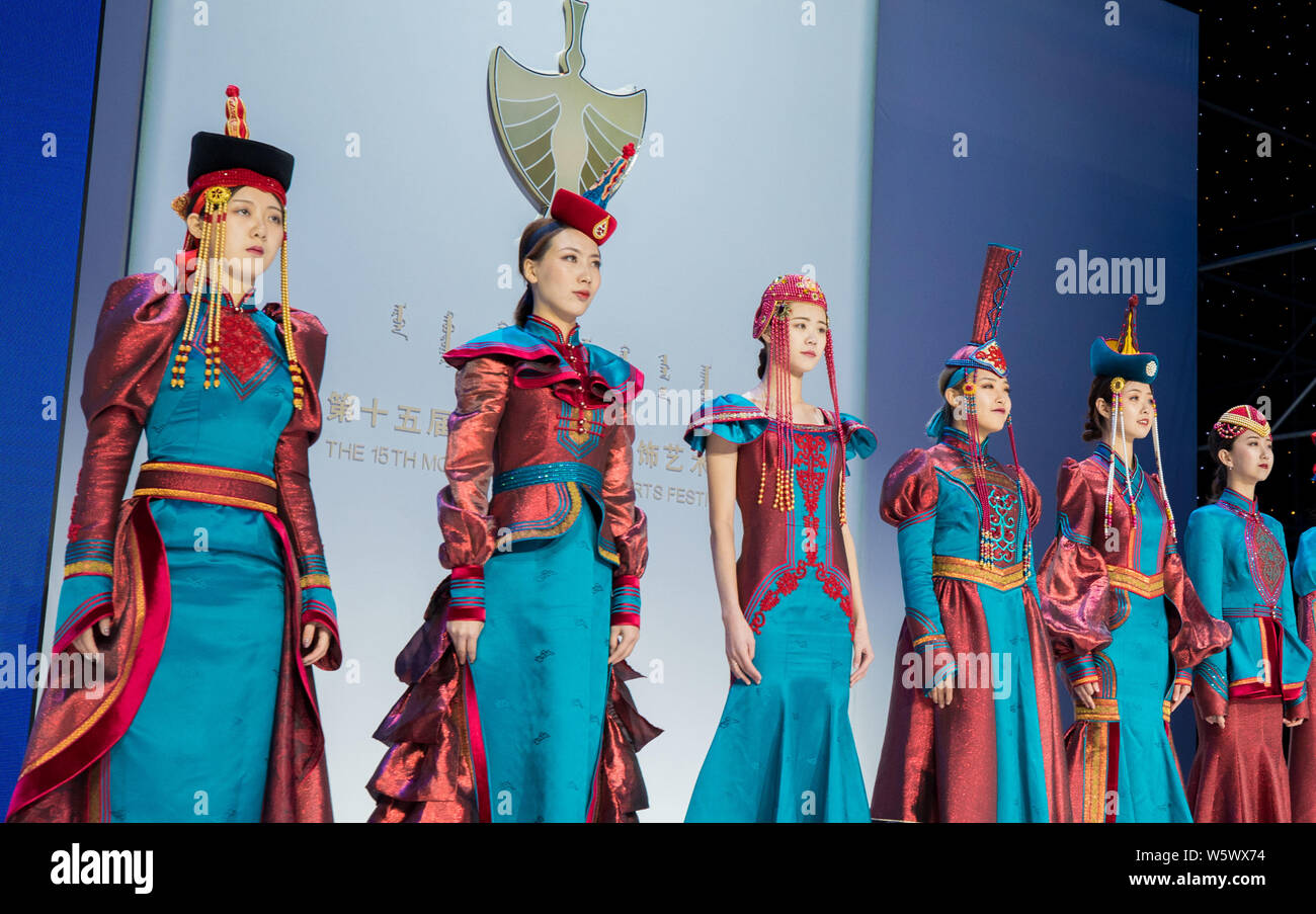 Models display new creations of traditional Mongolian costumes during ...