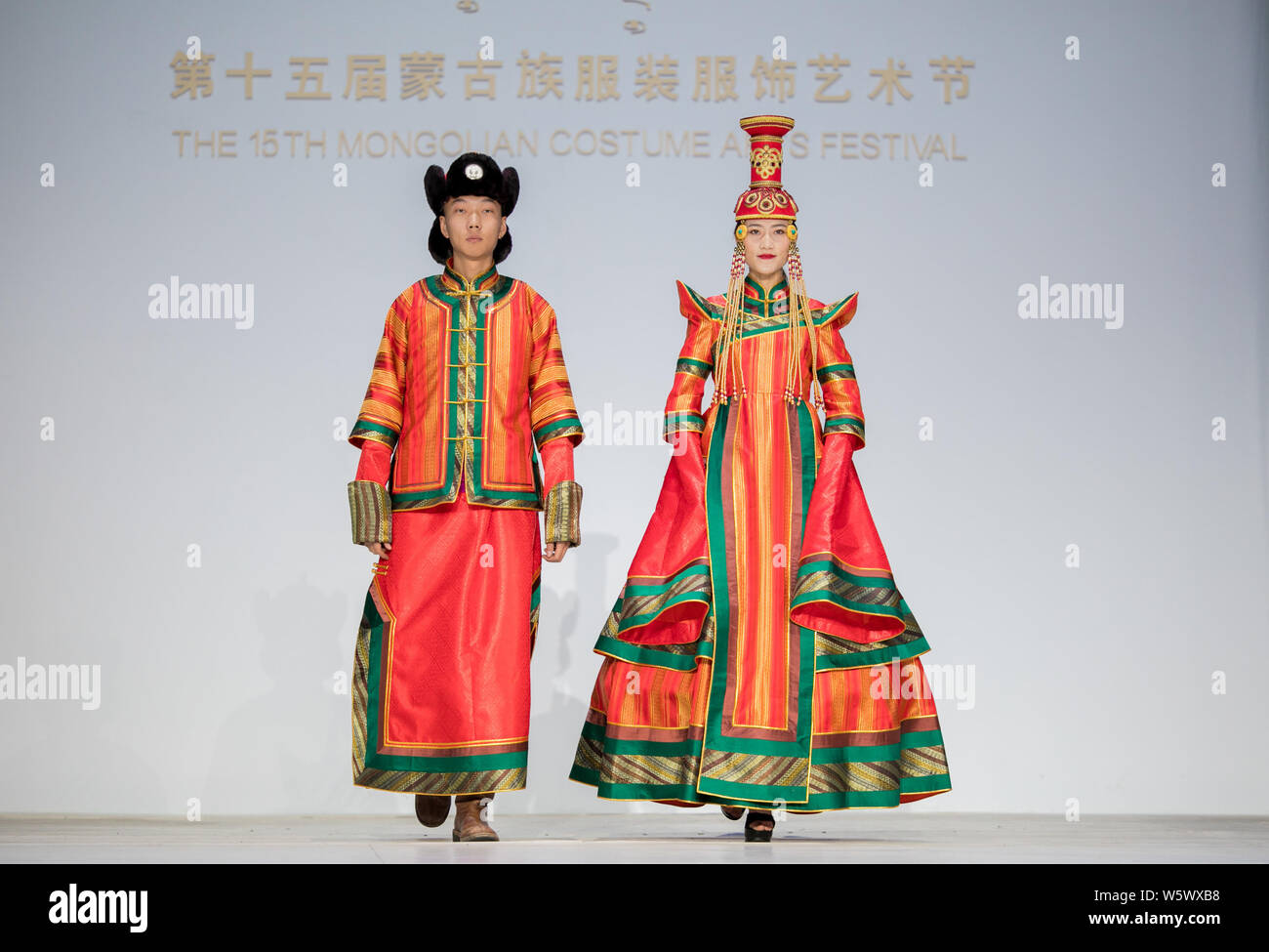 Models display new creations of traditional Mongolian costumes during ...