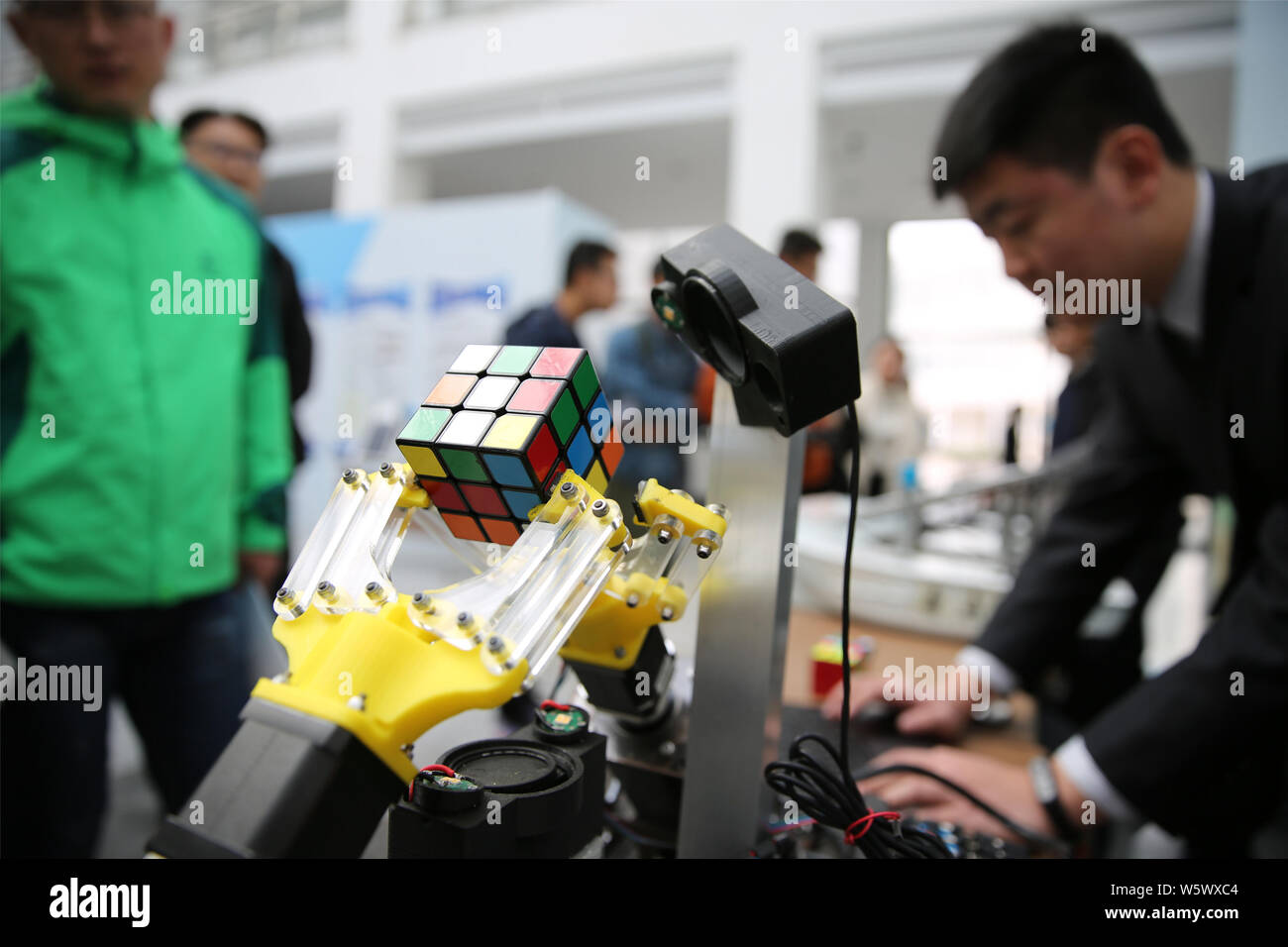 Students from a university present a bionic robotic arm during the ...