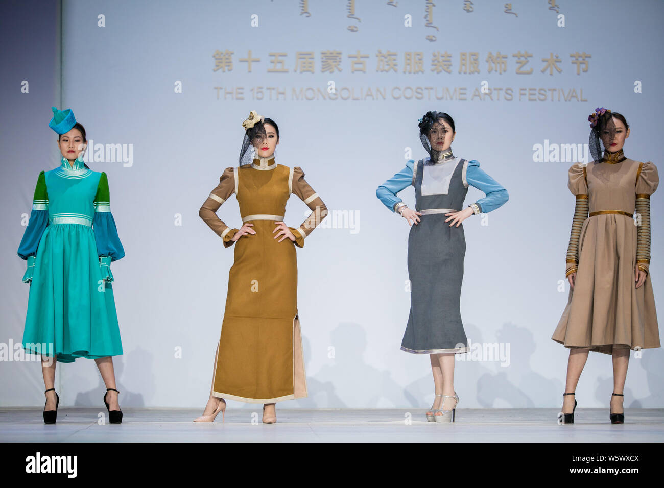 Models display new creations of traditional Mongolian costumes during ...