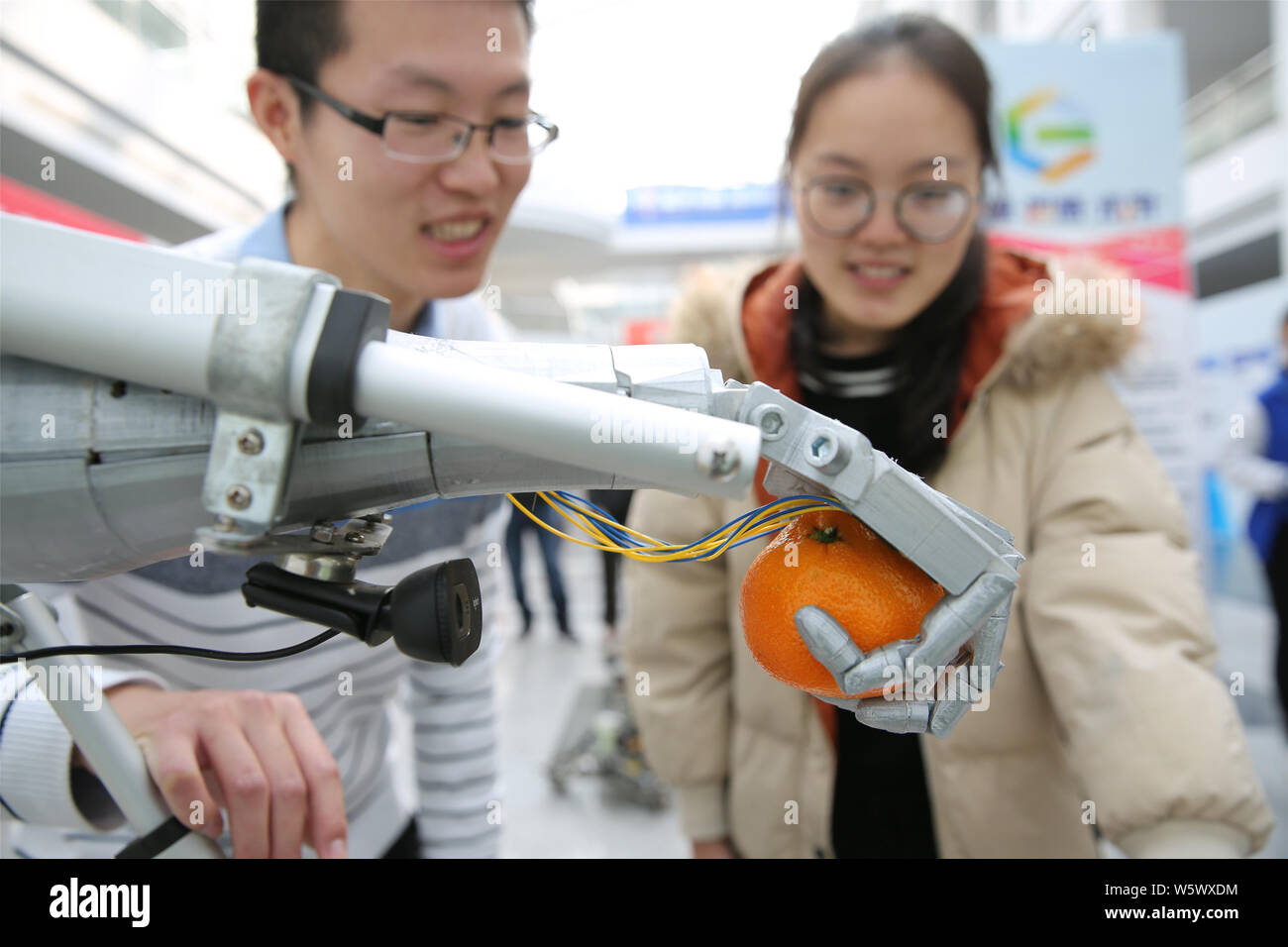 Students from a university present a bionic robotic arm during the ...