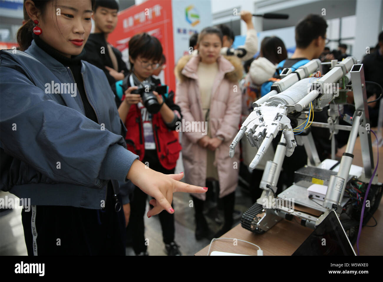 Students from a university present a bionic robotic arm during the ...