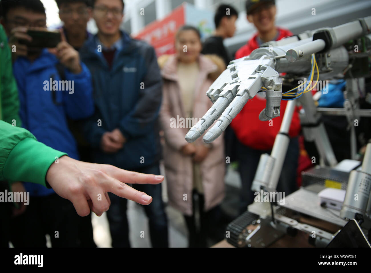 Students from a university present a bionic robotic arm during the ...