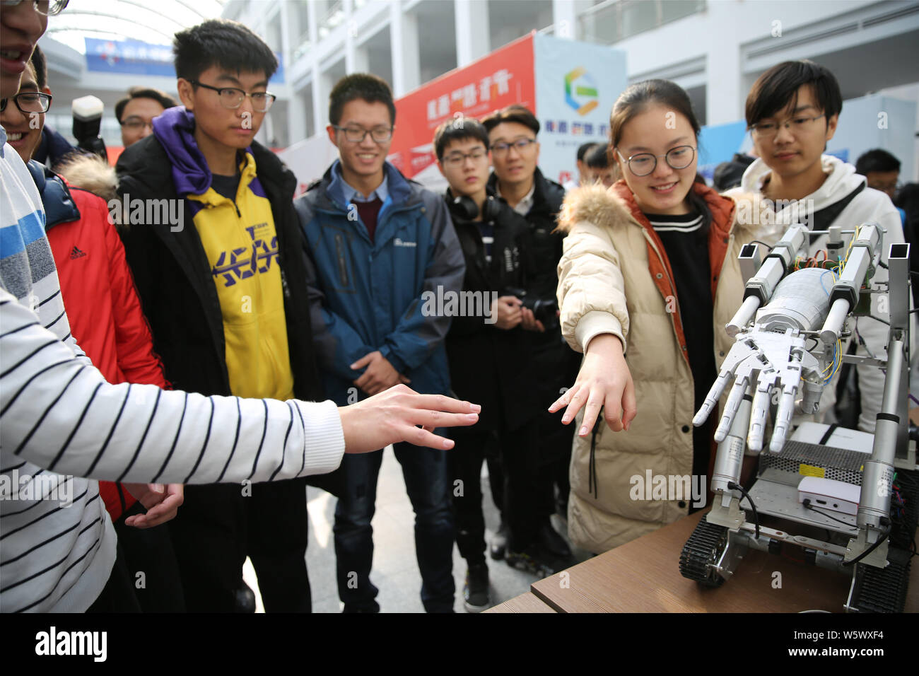 Students from a university present a bionic robotic arm during the ...