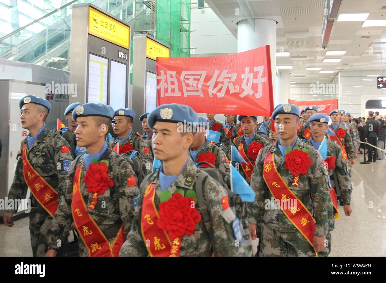 Chinese peacekeepers attend a welcome ceremony after returning to China ...