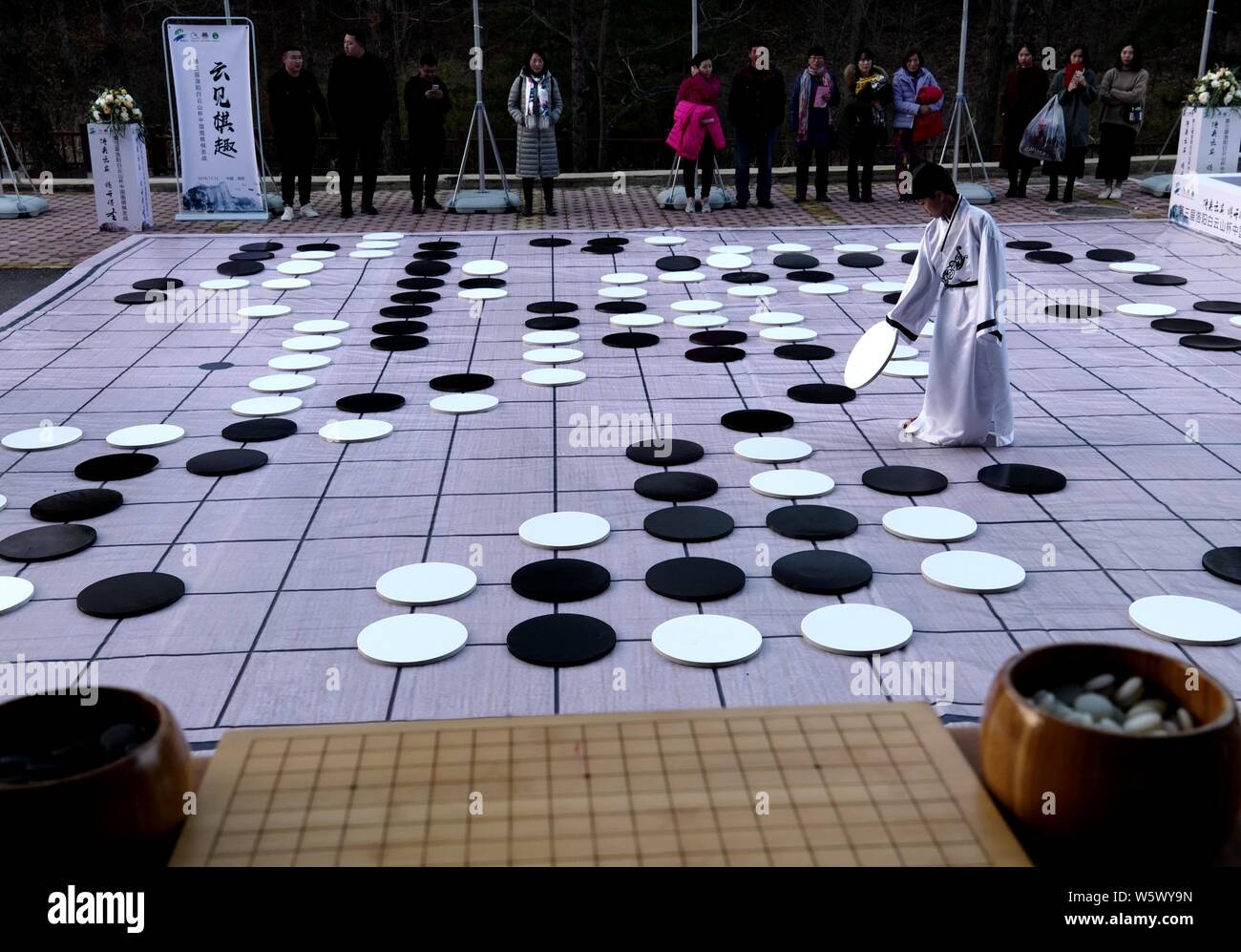 Little Chinese Go players dressed in traditional costumes take part in ...