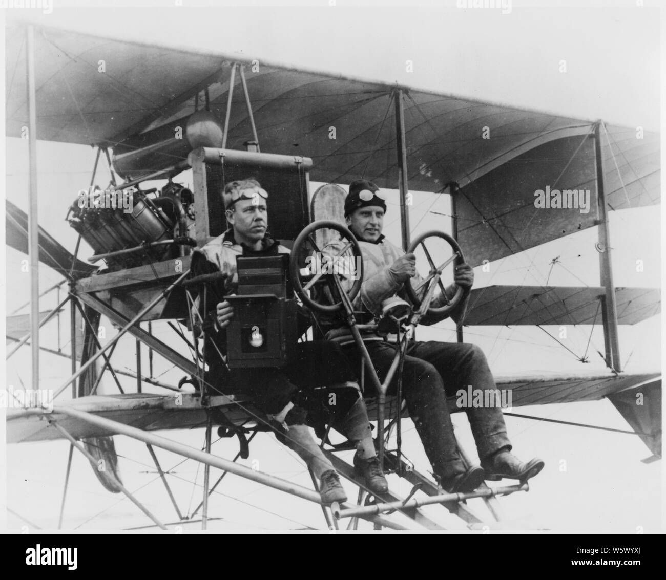 Pilot and photographer in AH-14 aircraft with Graflex camera Stock ...