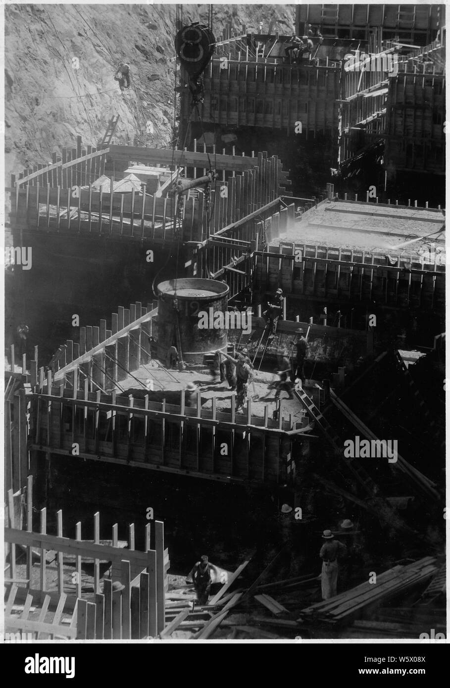 Placing concrete in panel or column forms near downstream toe in ...