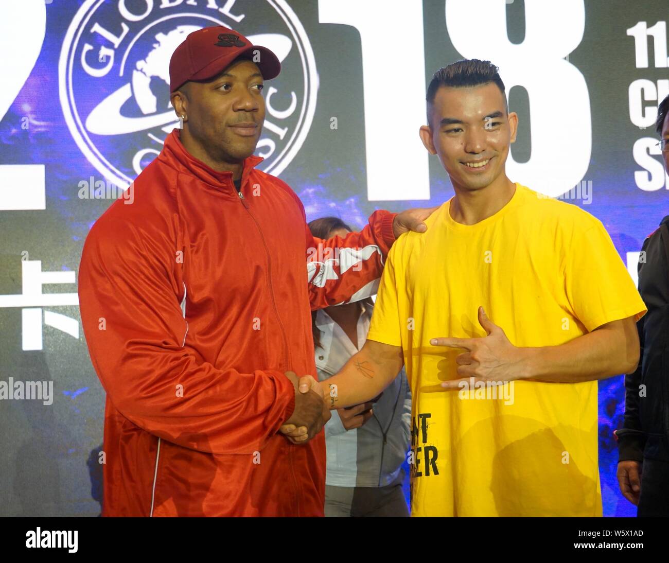 Jamaican-American IFBB professional bodybuilder Shawn Rhoden, left ...