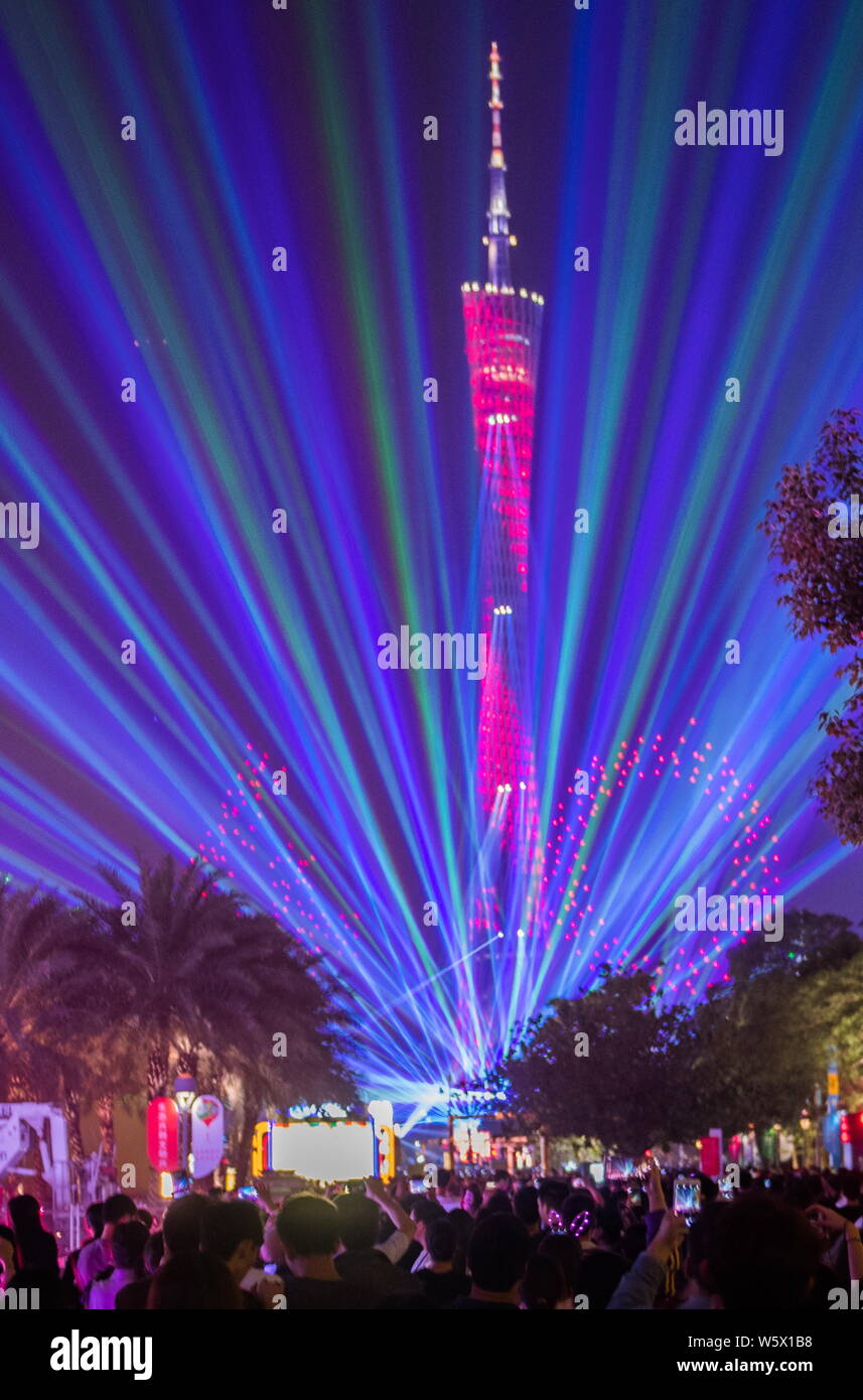 Tourists and visitors view colored lights during the seventh Guangzhou International Light ...