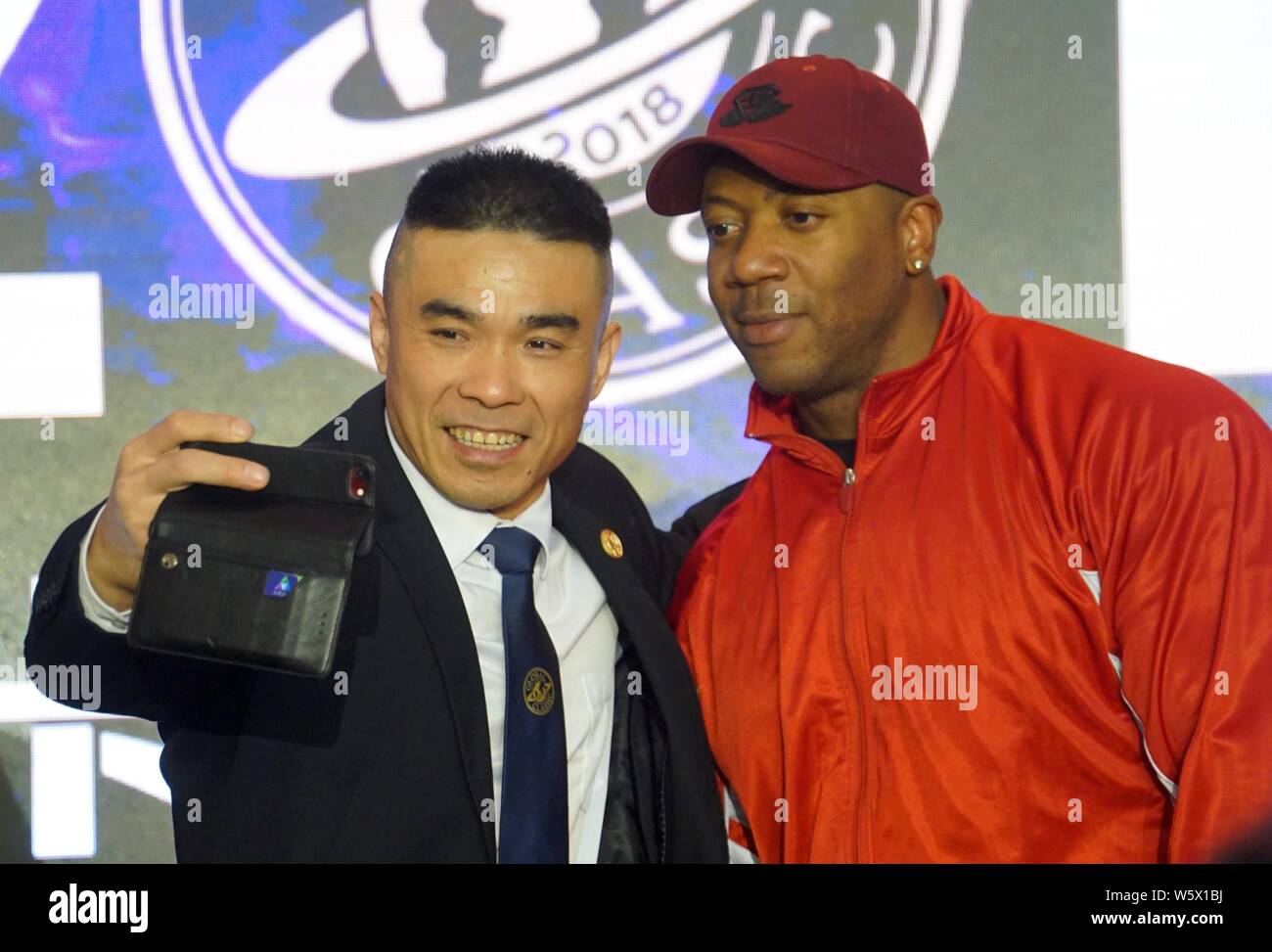 Jamaican-American IFBB professional bodybuilder Shawn Rhoden, right ...