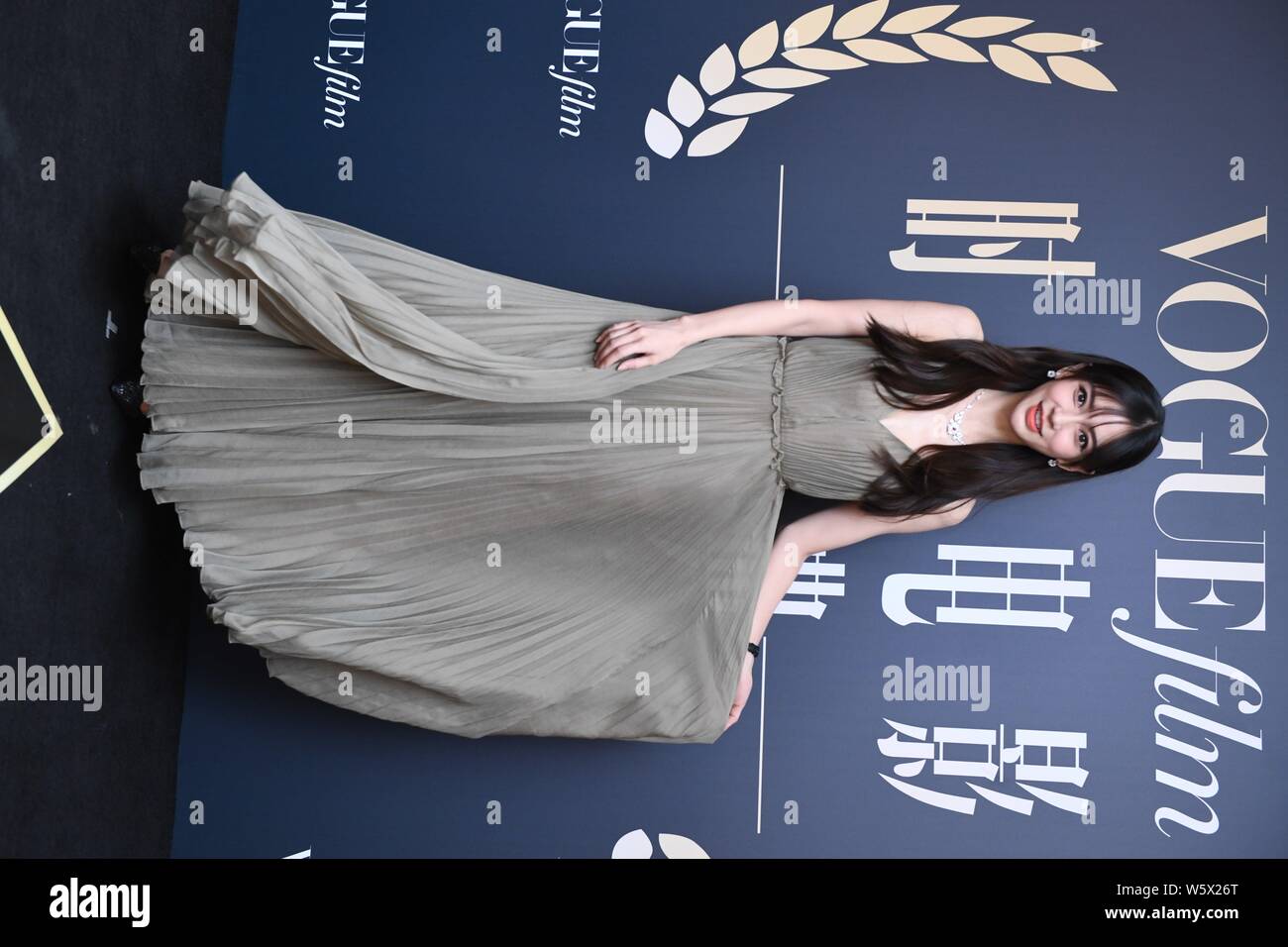 Hong Kong actress Angelababy poses as she arrives on the red carpet for 2018 Vogue Film ceremony ...