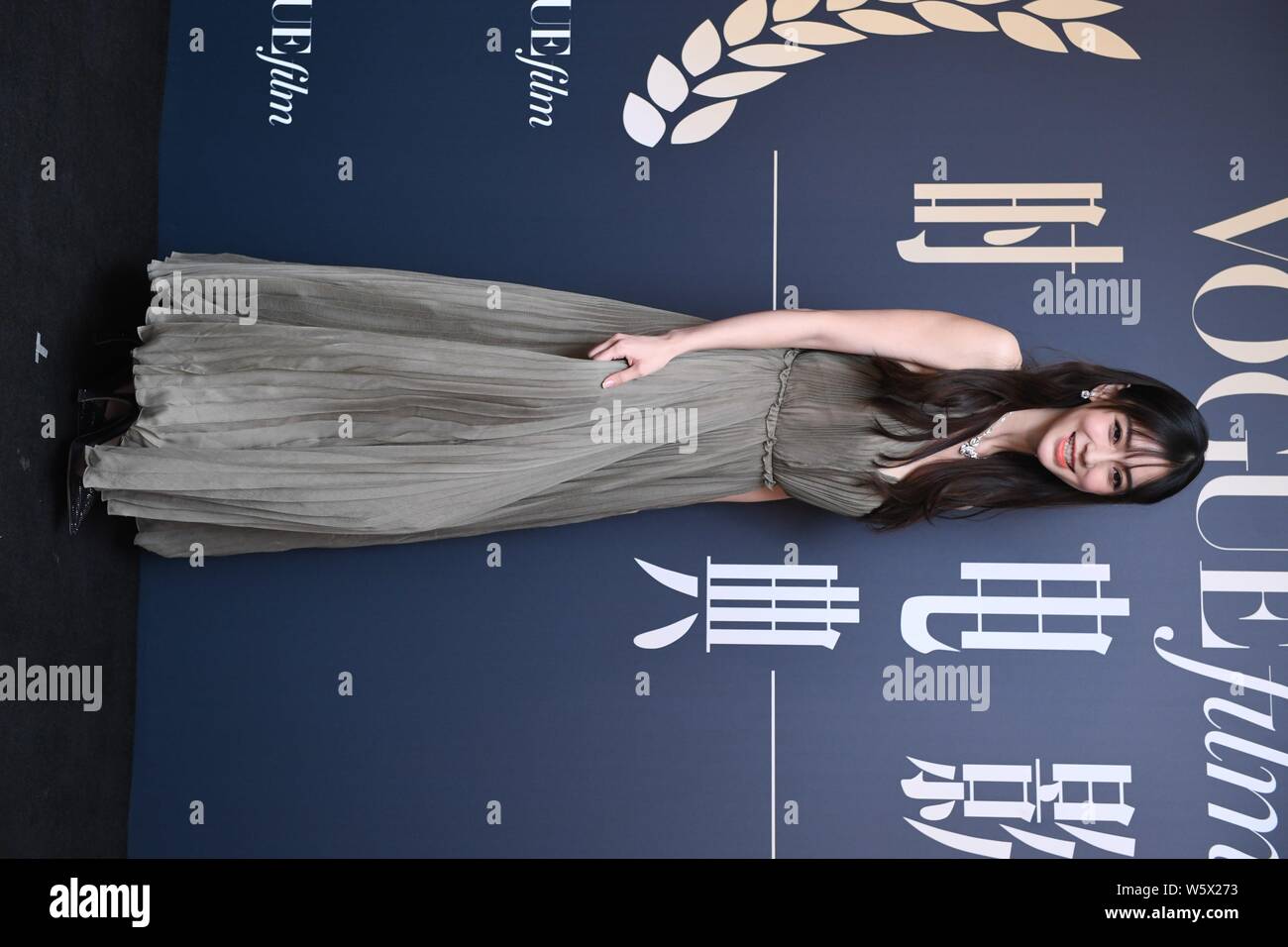 Hong Kong actress Angelababy poses as she arrives on the red carpet for 2018 Vogue Film ceremony ...