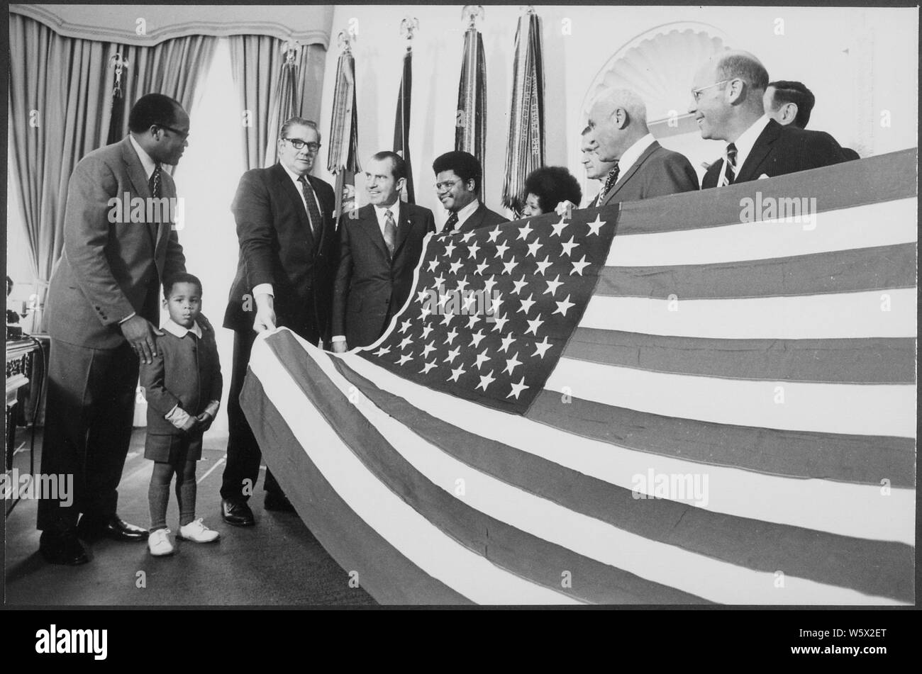 Presentation of American Flag; Scope and content: Pictured: Watts ...