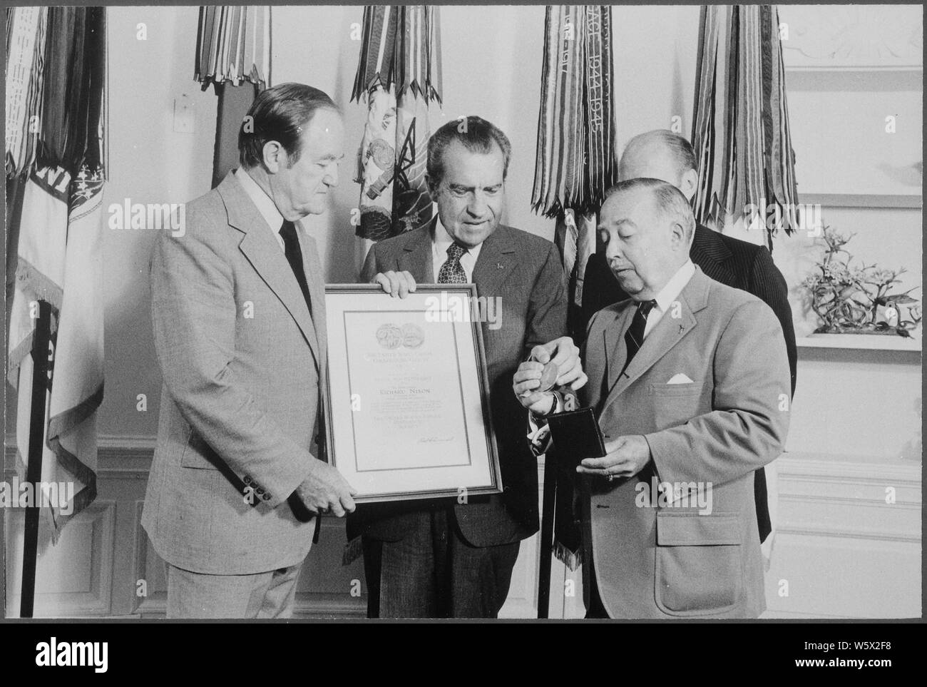 Presentation of a medallion commemorating the laying of the cornerstone ...