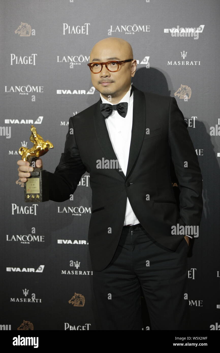 Chinese actor Xu Zheng poses with his trophy of the Best Leading Actor ...