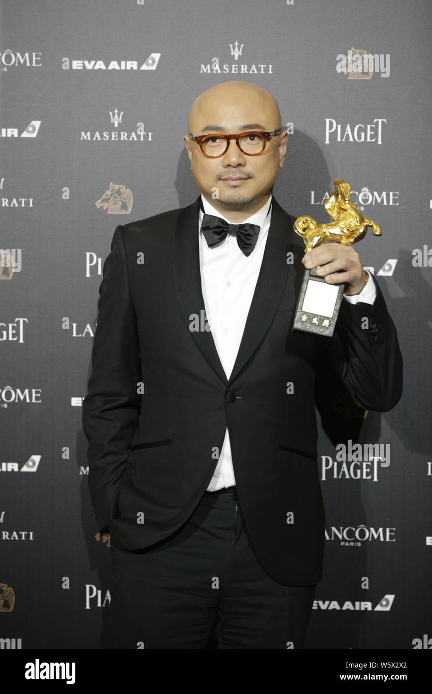 Chinese actor Xu Zheng poses with his trophy of the Best Leading Actor ...