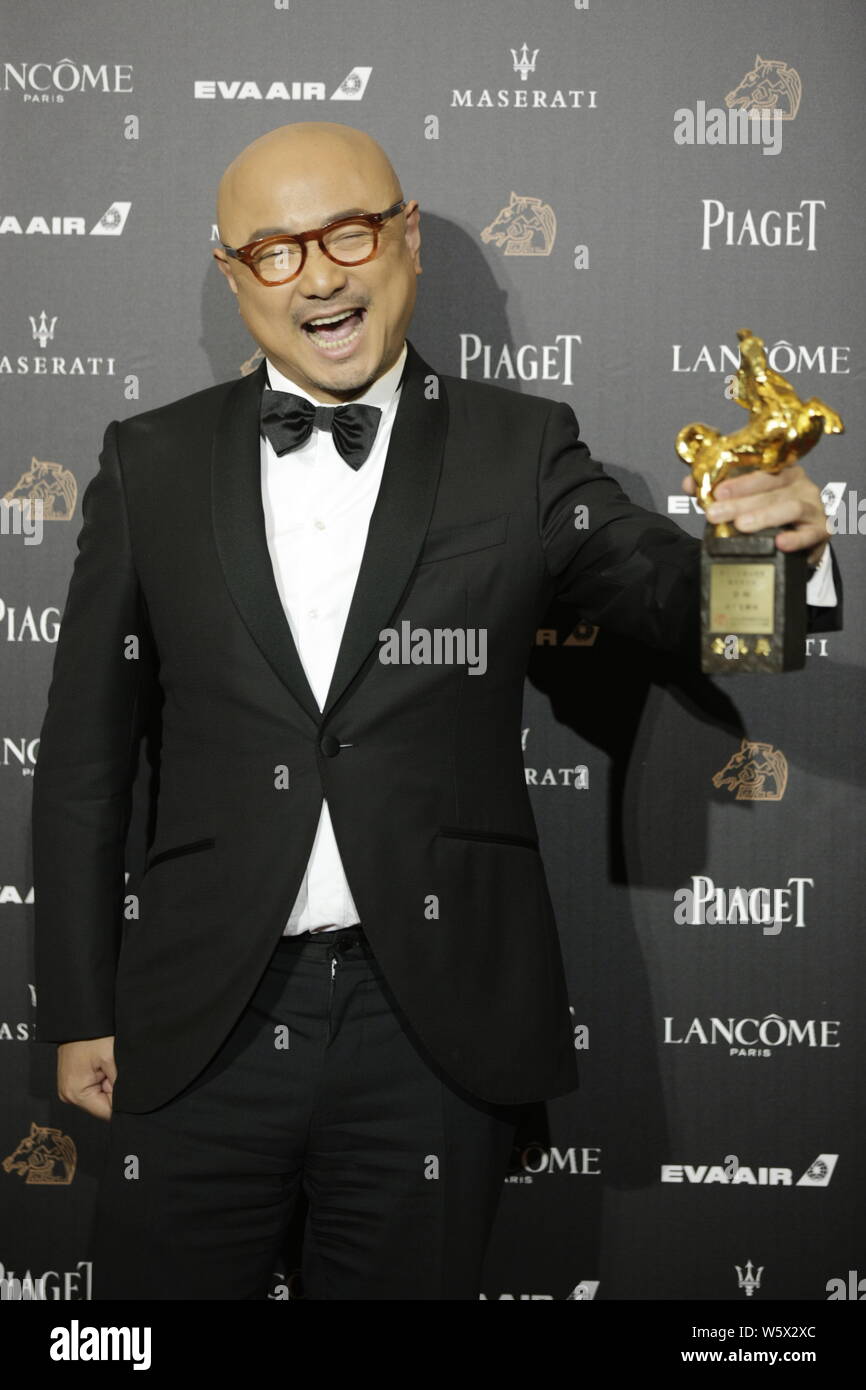 Chinese actor Xu Zheng poses with his trophy of the Best Leading Actor ...