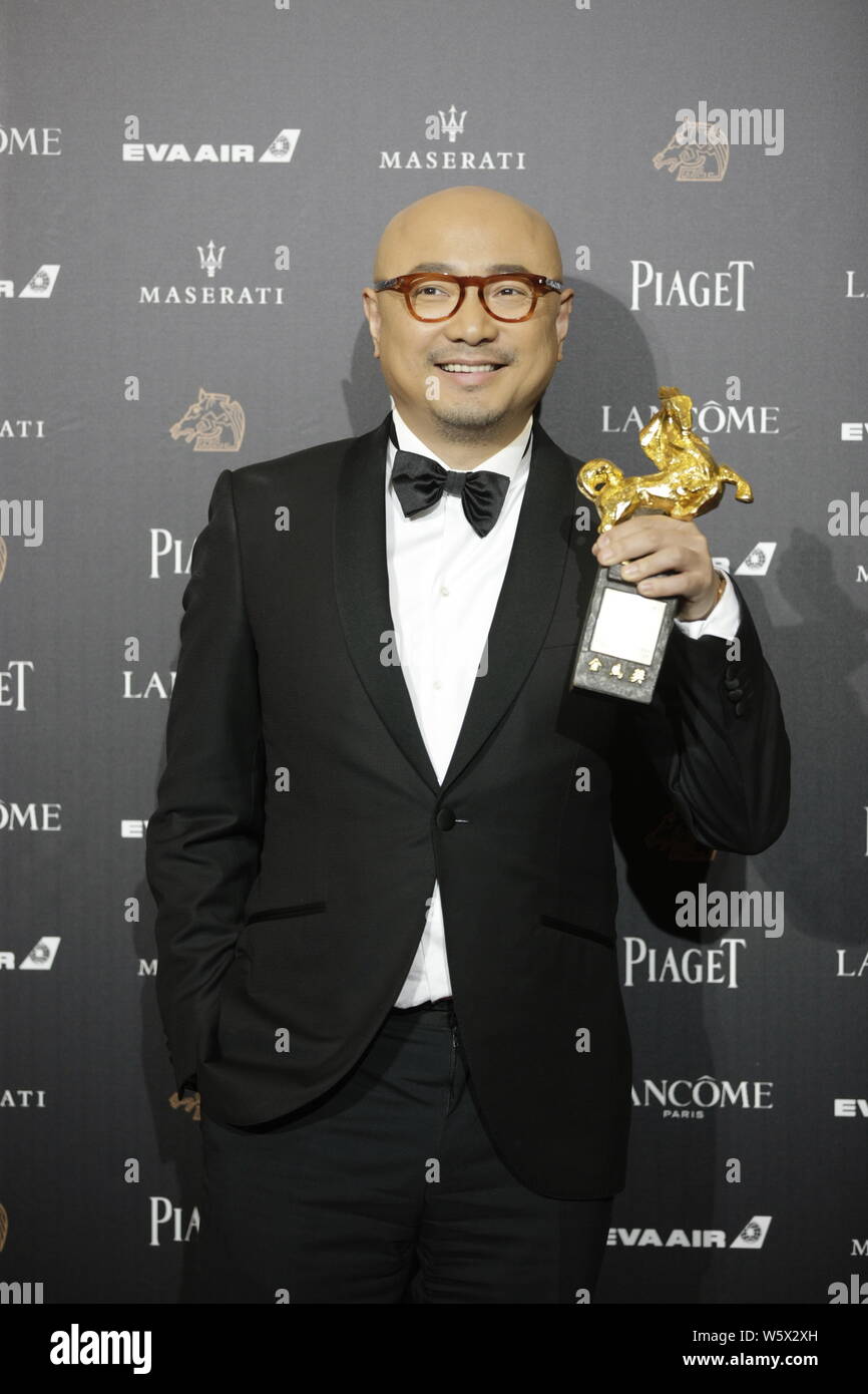 Chinese actor Xu Zheng poses with his trophy of the Best Leading Actor ...