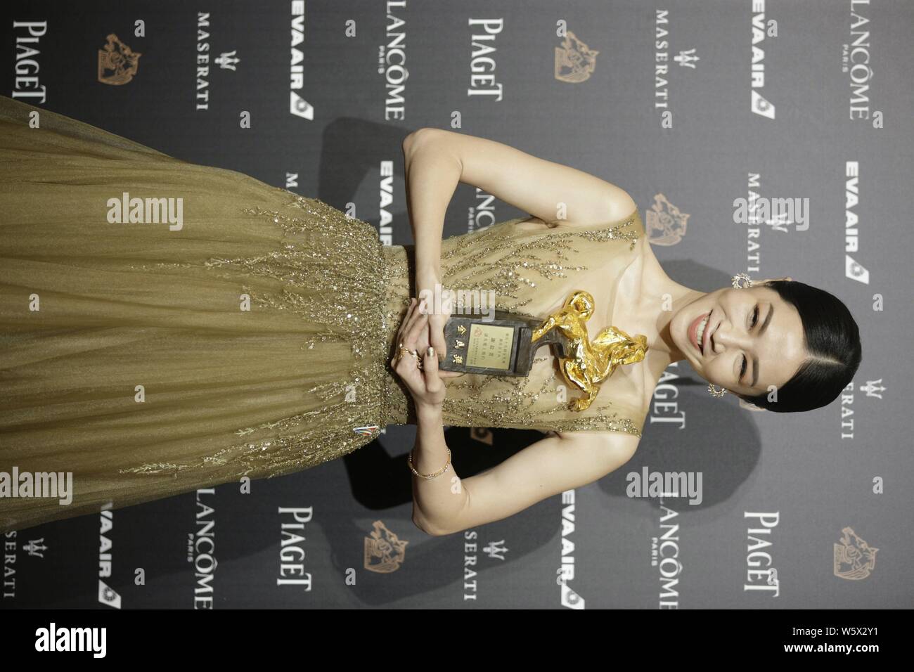 Taiwanese stage actress Hsieh Ying-xuan poses with her trophy of the ...