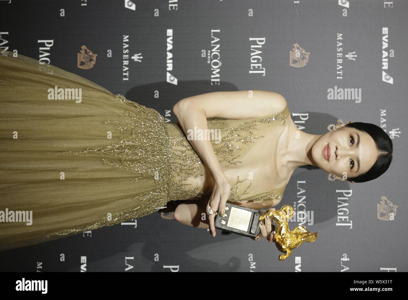 Taiwanese stage actress Hsieh Ying-xuan poses with her trophy of the ...