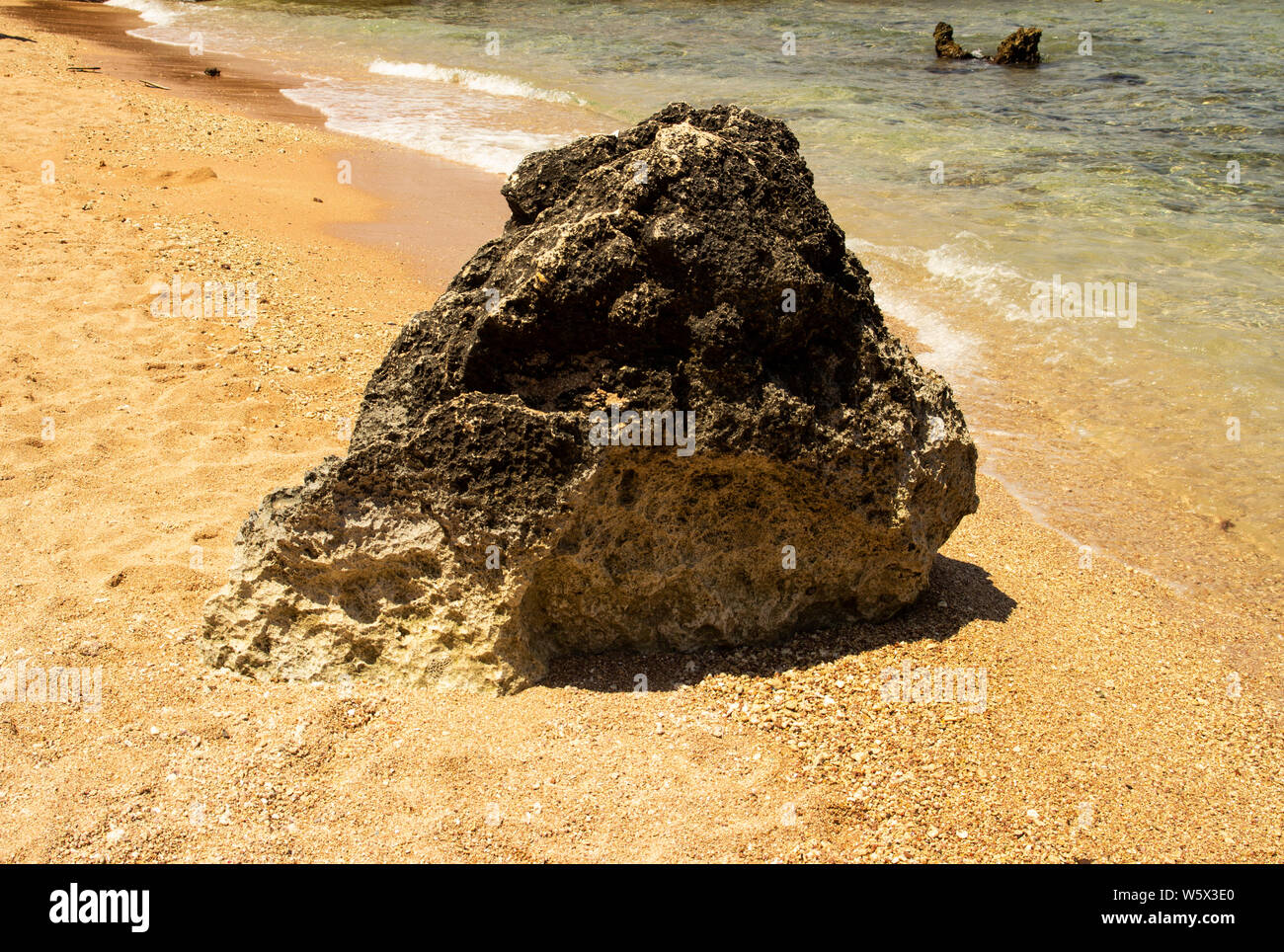 Summer background of hot sand with sea or ocean wave bubbles with copy ...