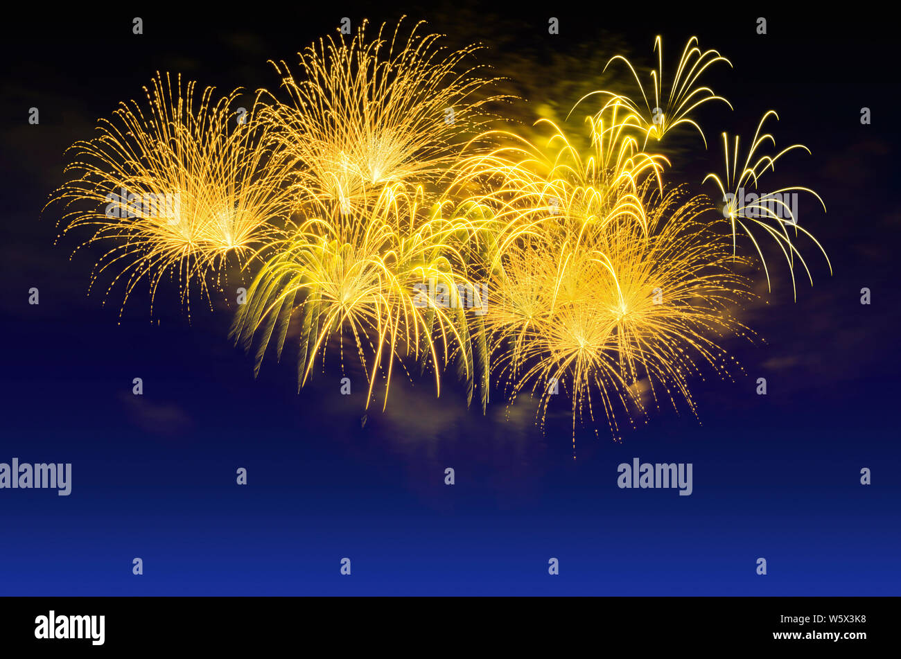 Yellow fireworks celebration and the twilight sky background Stock ...
