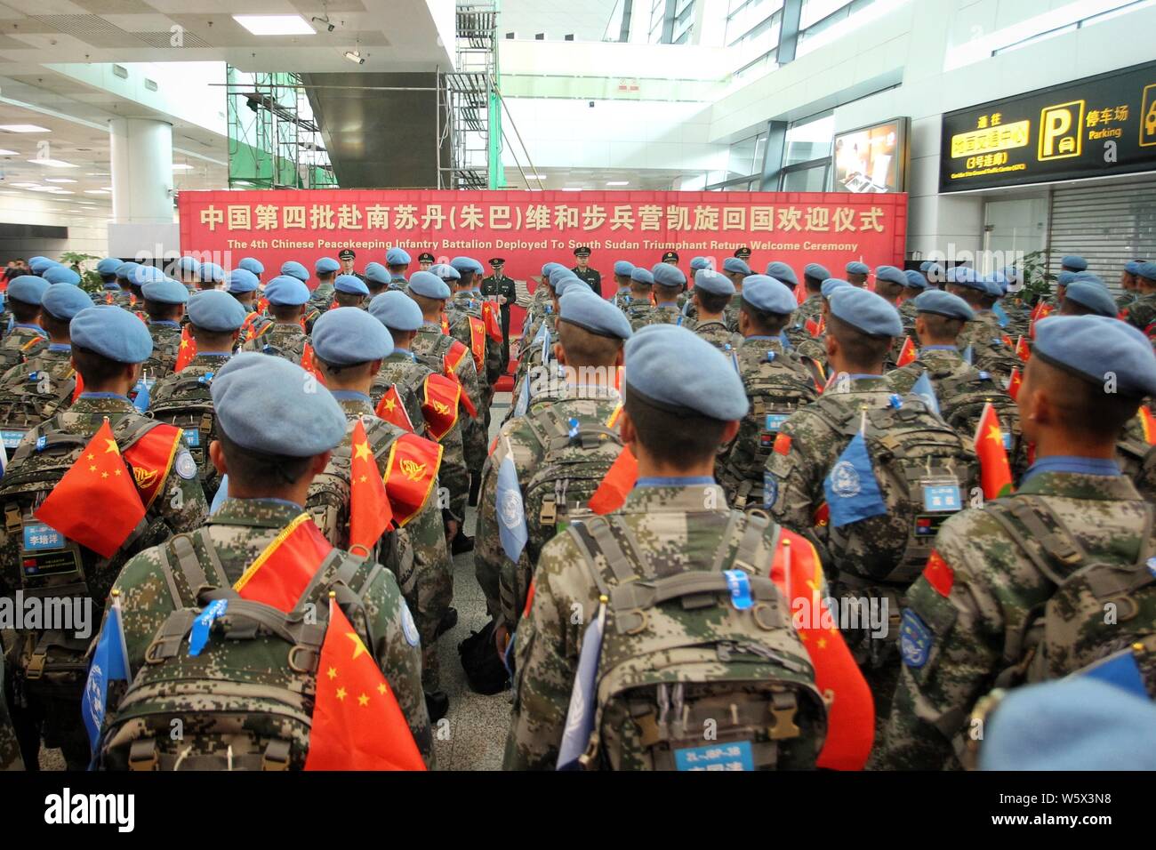 Chinese peacekeepers attend a welcome ceremony after returning to China ...
