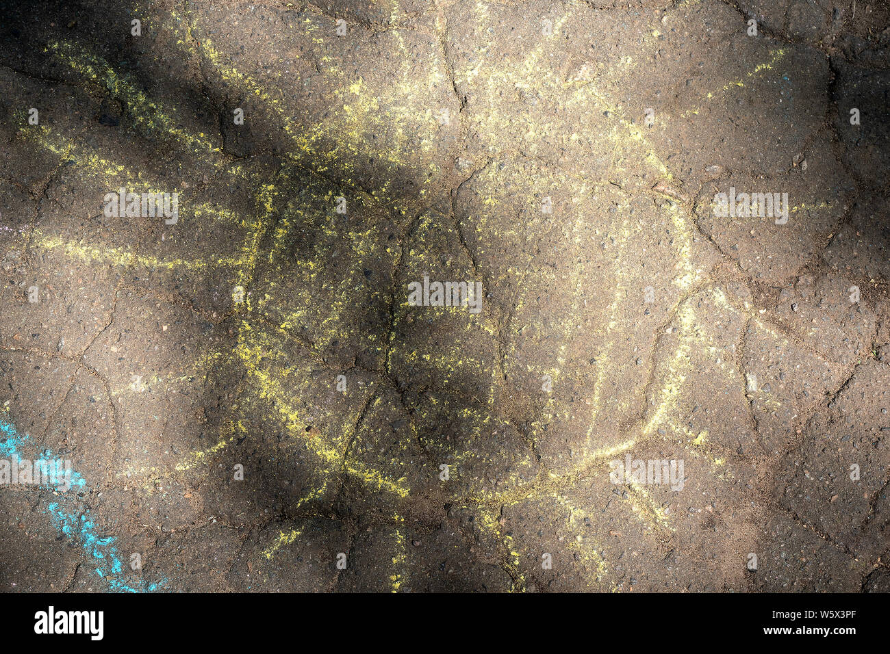 Drawn sun with yellow chalk on asphalt Stock Photo - Alamy
